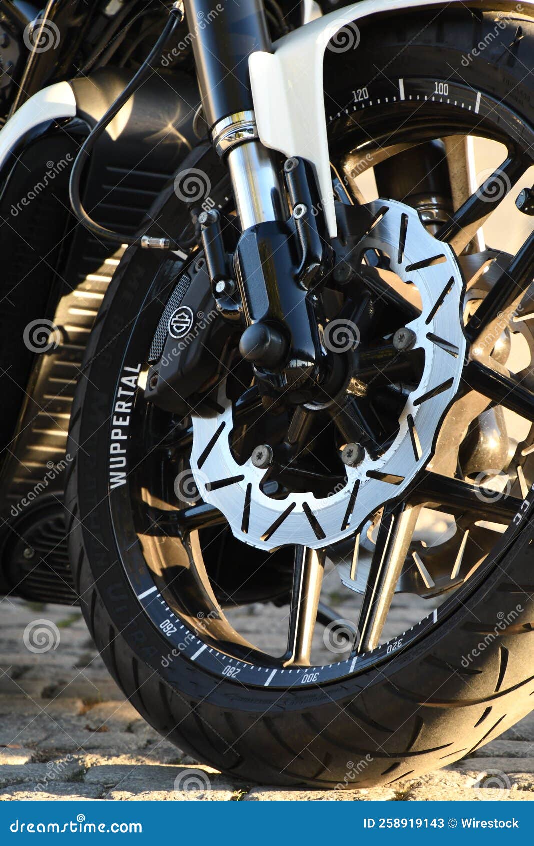 Vertical Closeup of a Front Wheel of a Chopper Motorcycle Editorial ...