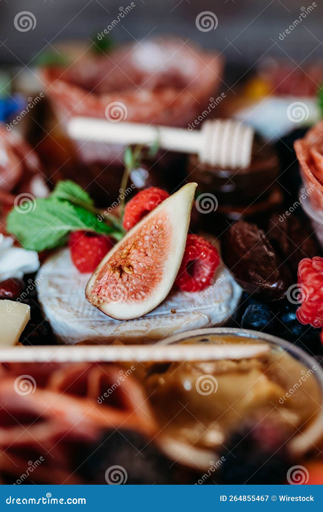 Vertical Closeup of Fruits, Honey, and Meat Snacks Stock Image - Image ...