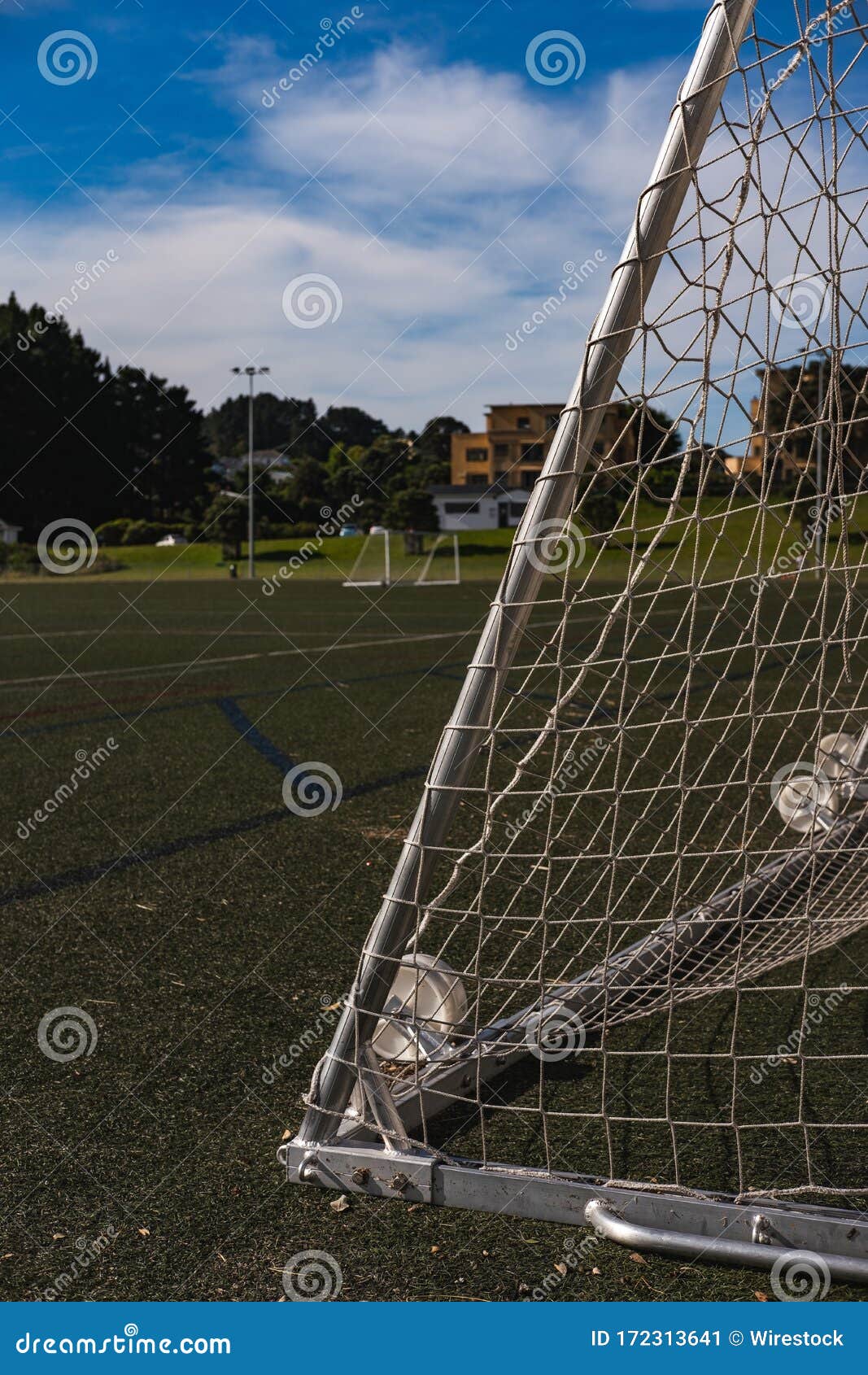 Vertical Closeup of a Goal Post on the Field Under the Sunlight and a ...