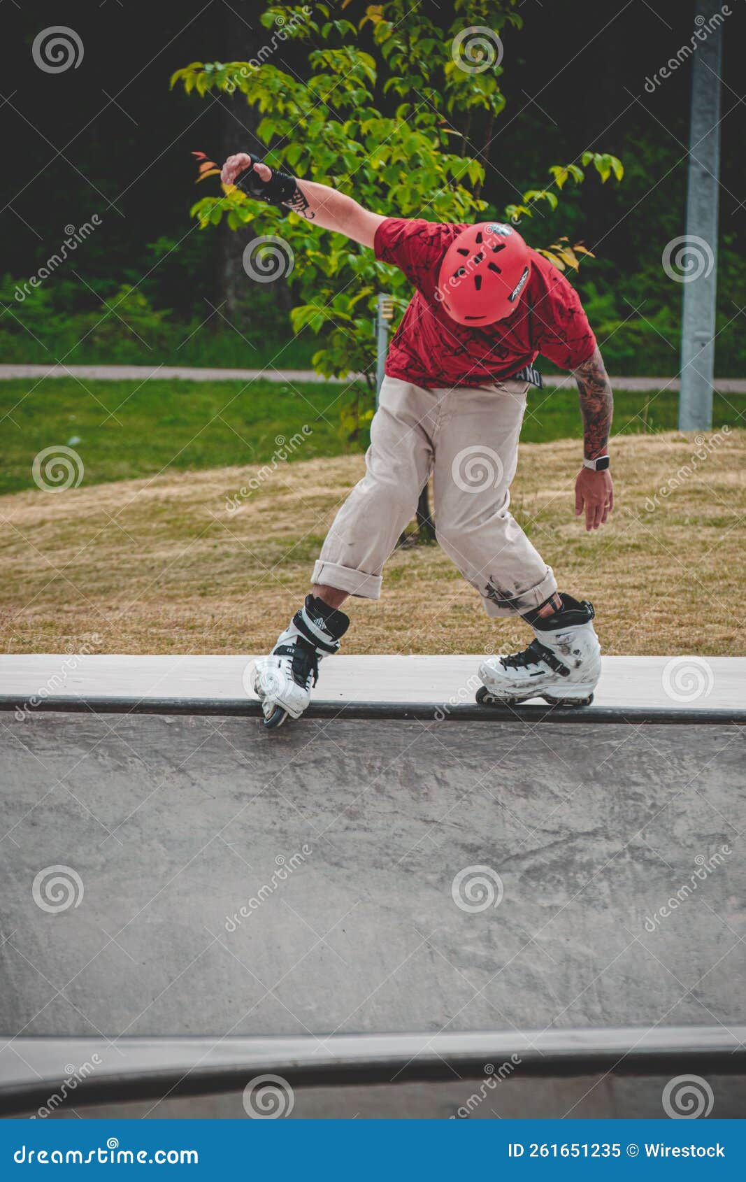 Vertical Closeup of an Inline Skater in a Skating Rink Practicing Moves ...