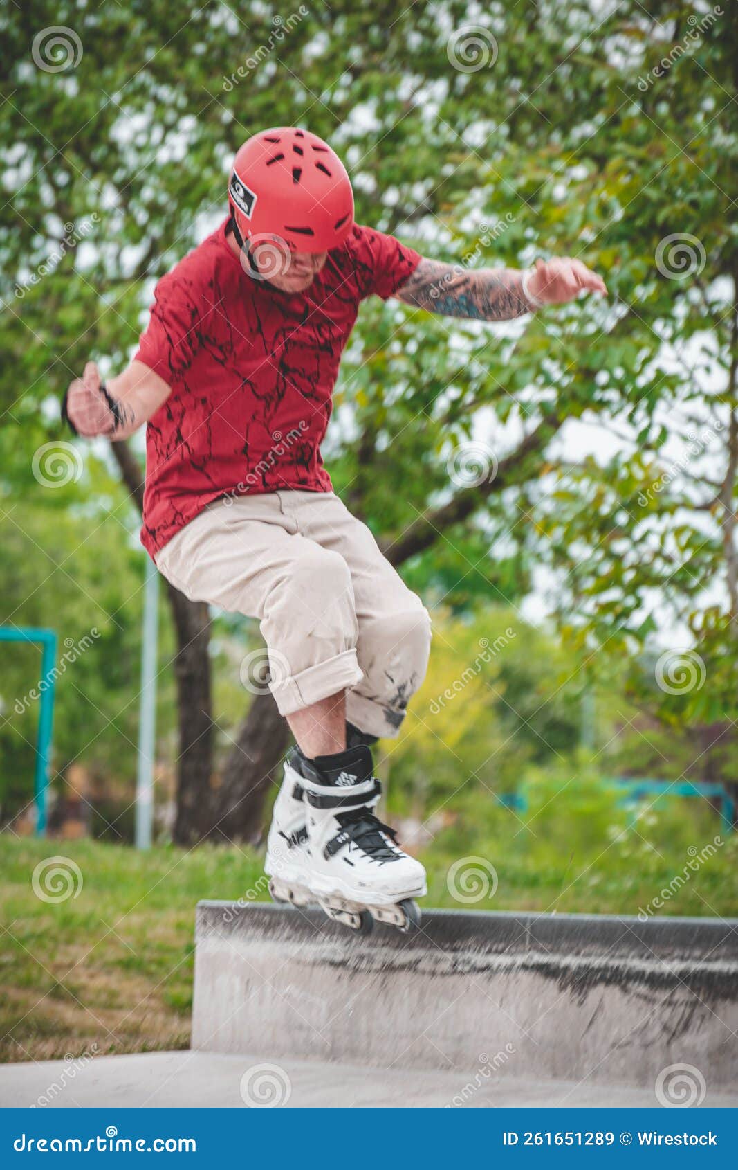 Vertical Closeup of an Inline Skater in a Skating Rink Practicing Moves ...