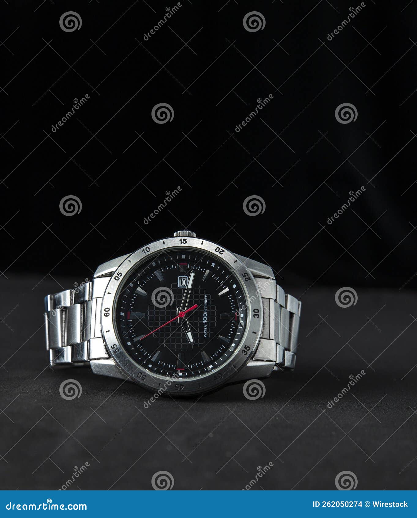 Vertical Closeup of a Metal Silver Watch Exhibition on a Black Surface ...