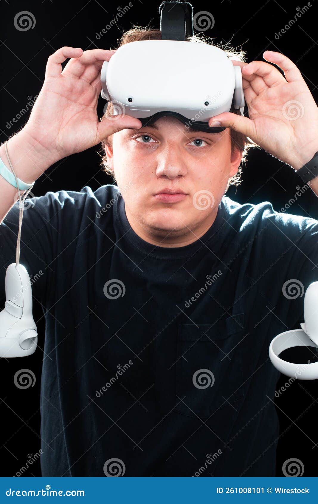 Vertical Closeup of a Nerdy Young Man with a VR Headset Against a Black ...