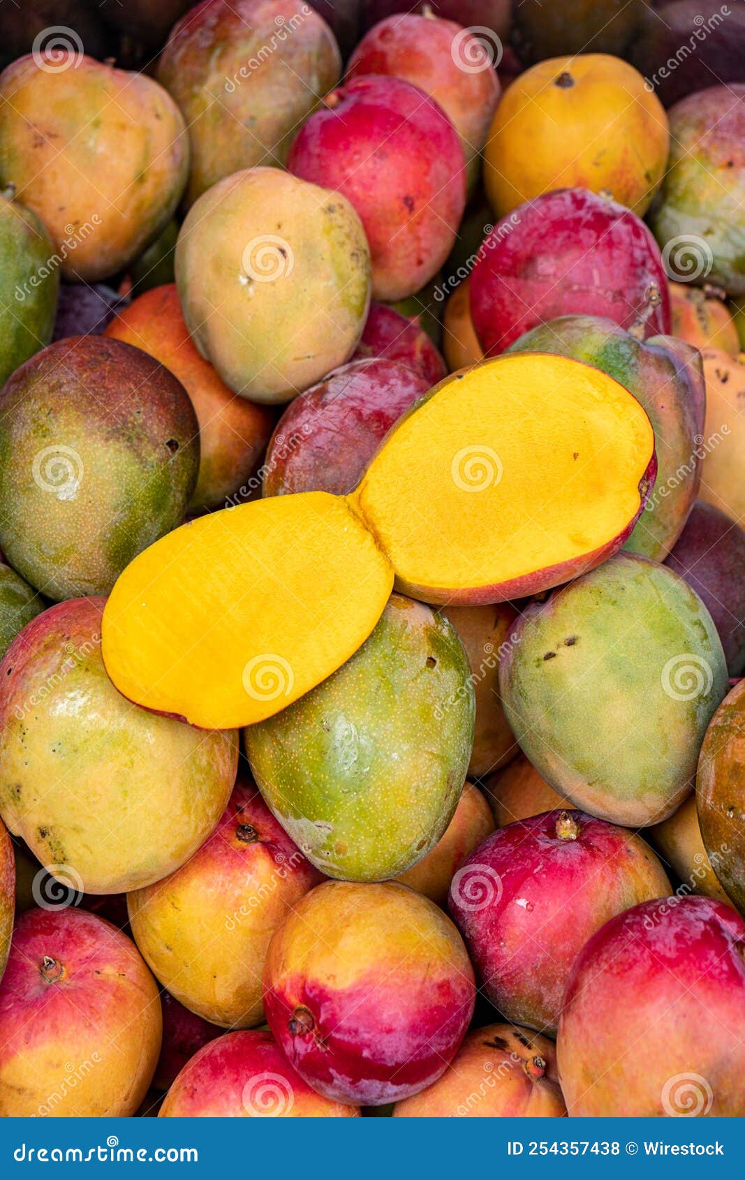 Vertical Closeup of a Pile of Fresh Mangos Stock Photo - Image of ...