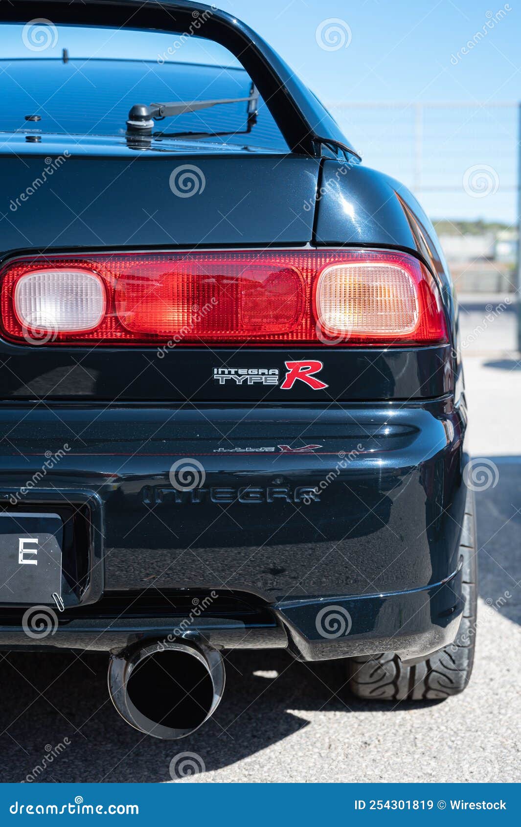 Vertical Closeup of a Rear of a Black Third-generation Honda Integra ...