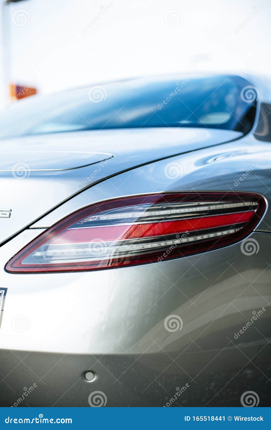 Vertical Closeup Shot of the Back Light of a Modern Silver Car Stock ...