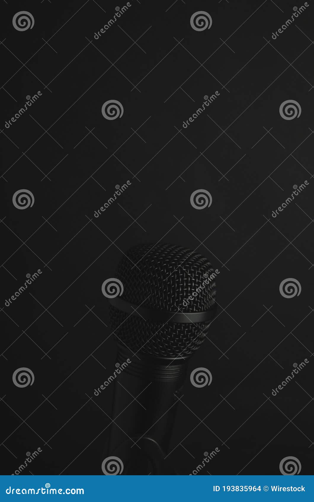 Vertical Closeup Shot of a Black Microphone on a Black Background Stock ...