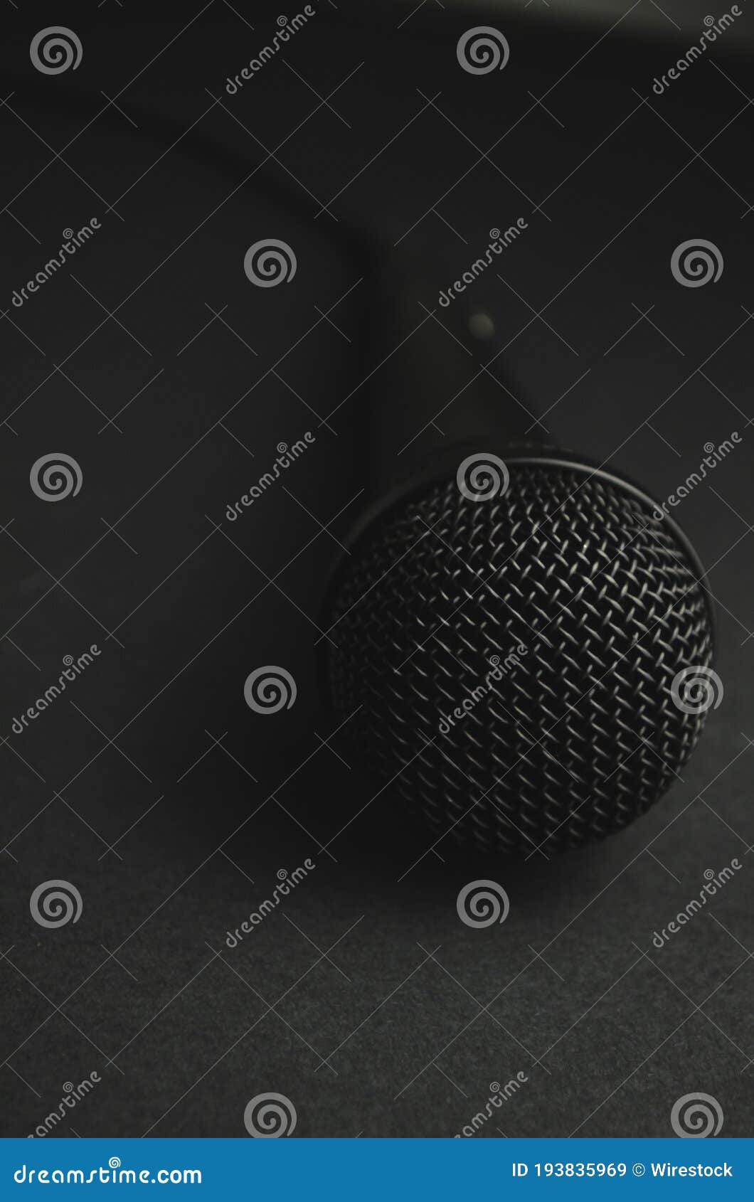 Vertical Closeup Shot of a Black Microphone on a Black Background Stock ...
