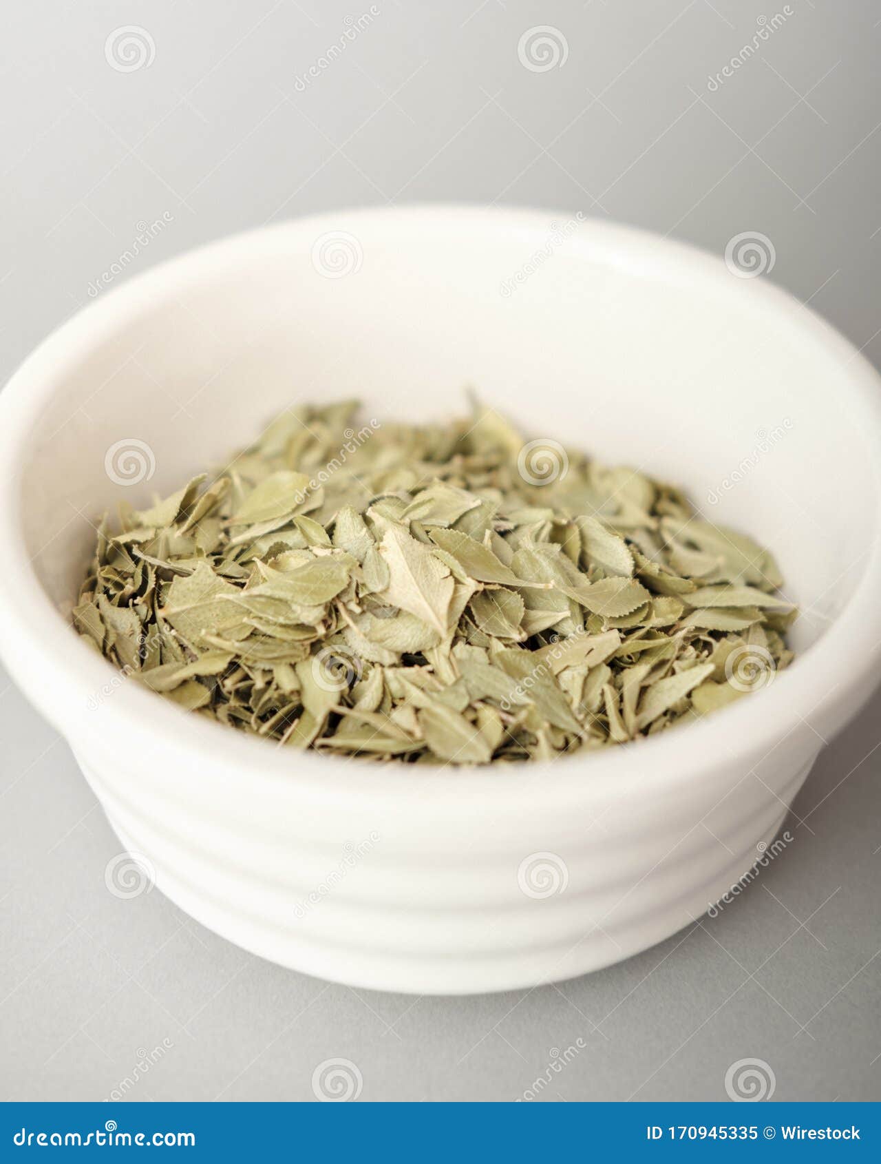 Vertical Closeup Shot of a Bowl of Buchu Leaves on a White Surface ...
