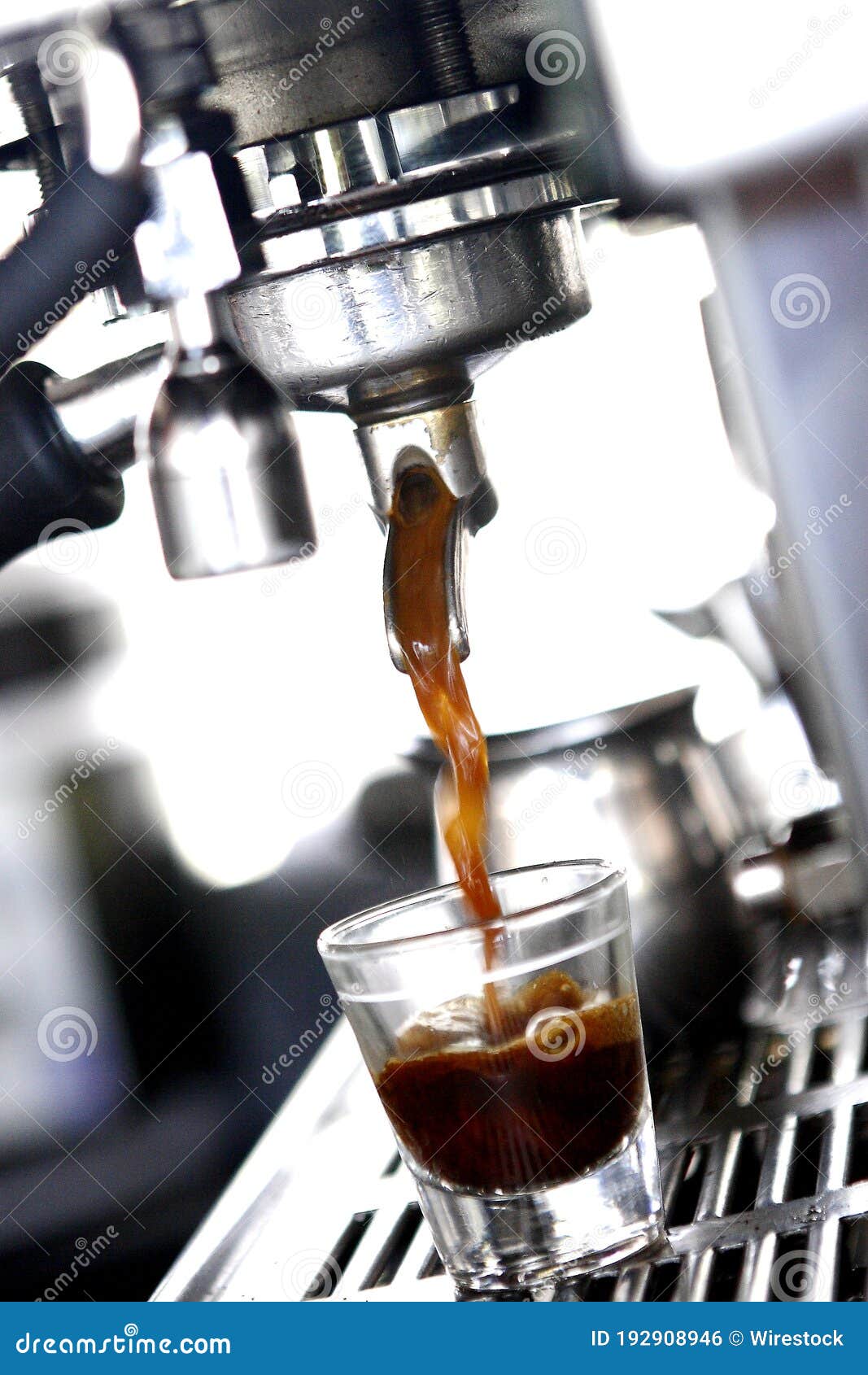 Vertical Closeup Shot of Coffee Machine Brewing Fresh Espresso in Glass ...