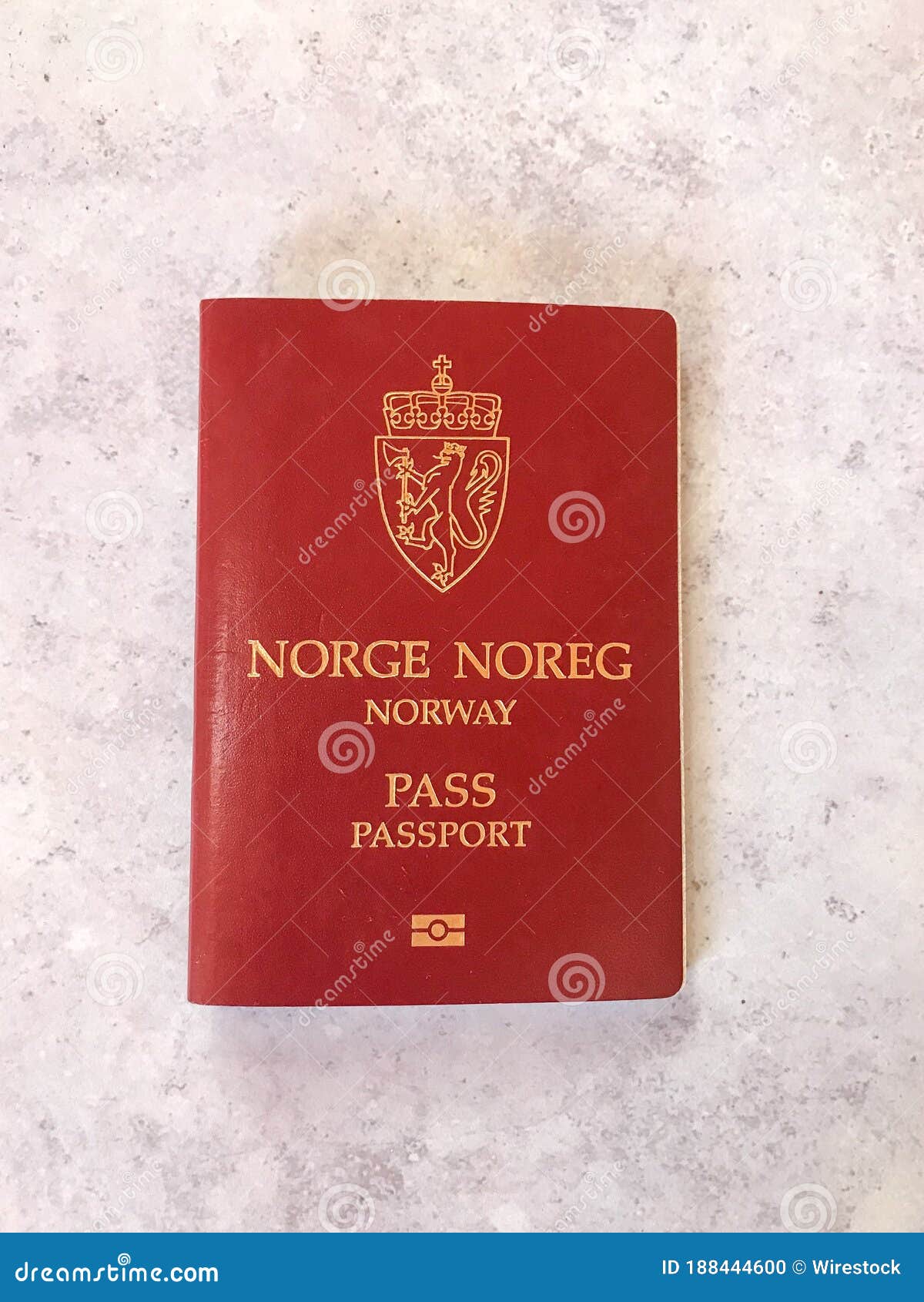 Vertical Closeup Shot of a Norwegian Passport on a Grey Surface Stock ...