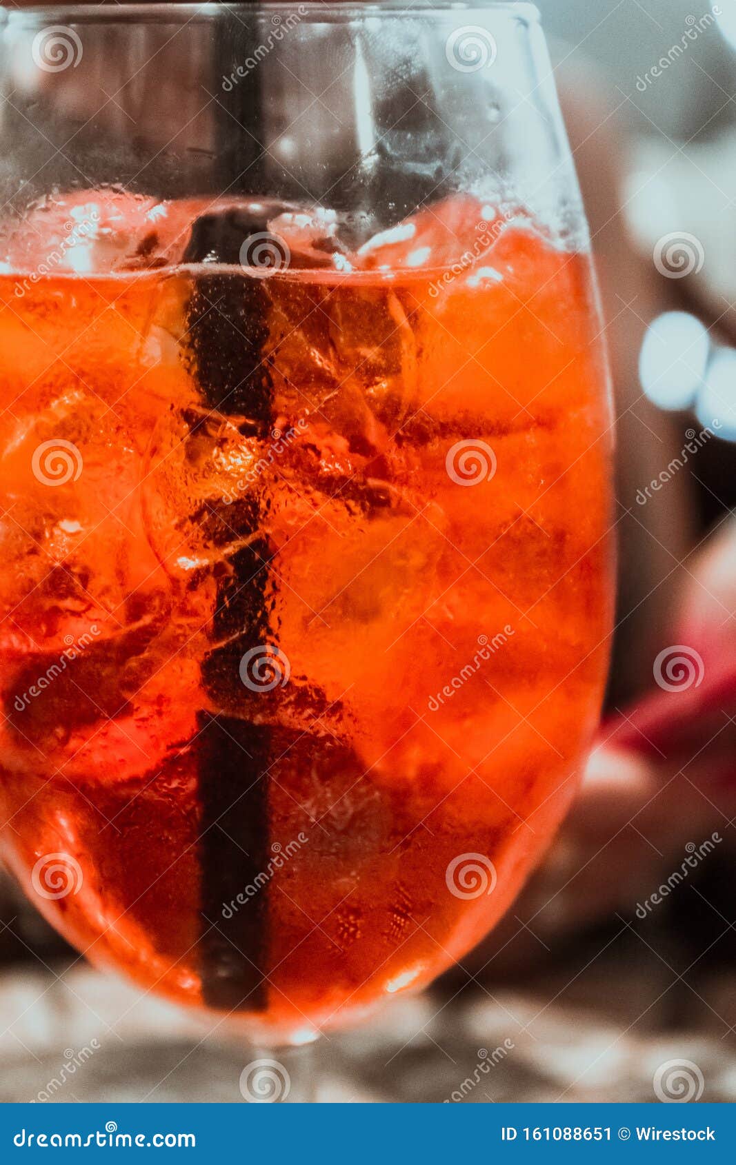 Vertical Closeup Shot of an Orange Cocktail with a Blurred Background ...