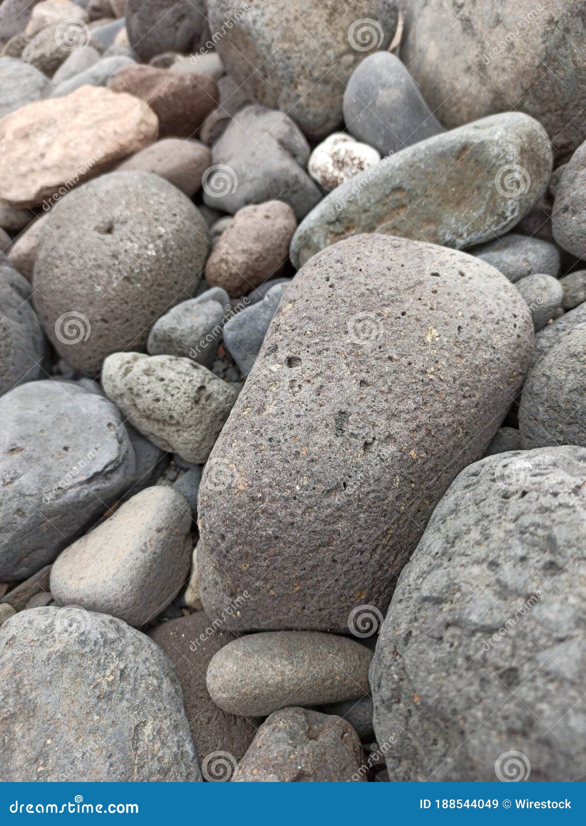 Vertical Closeup Shot of Rocks of Different Sizes on the Beach Stock ...