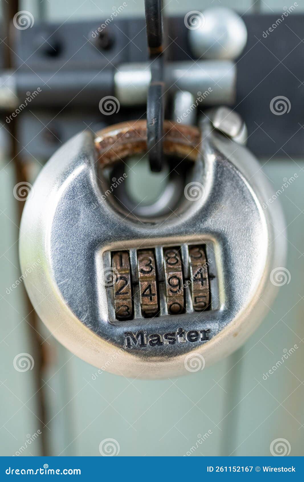 Vertical Closeup Shot of Rusty Metal Lock with Passcode Numbers Hung on ...