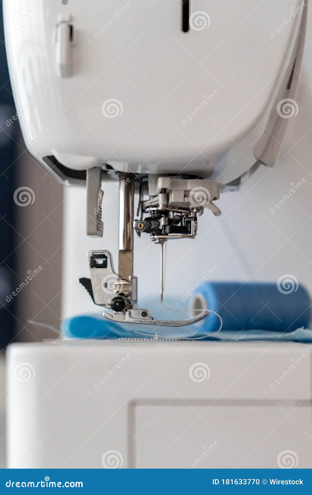 Vertical Closeup Shot of the Thread and the Needle of a Sewing Machine ...