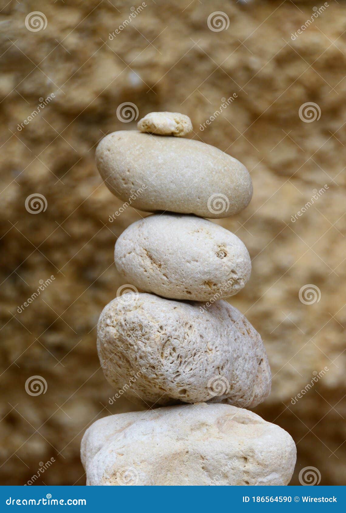 Vertical Closeup Shot of White Pebbles Balanced on Top of Each Other ...