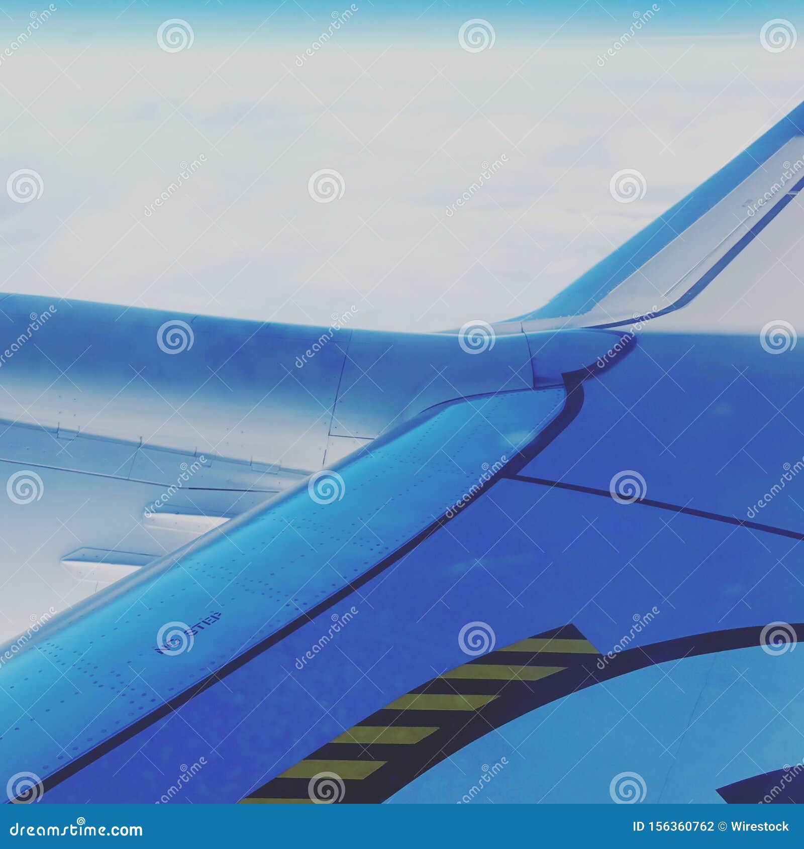 Vertical Closeup Shot of the Wing of a Plane Stock Photo - Image of ...