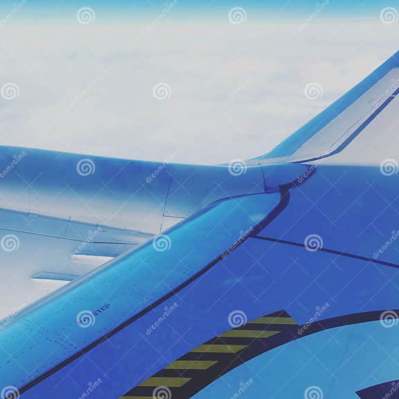 Vertical Closeup Shot of the Wing of a Plane Stock Photo - Image of ...