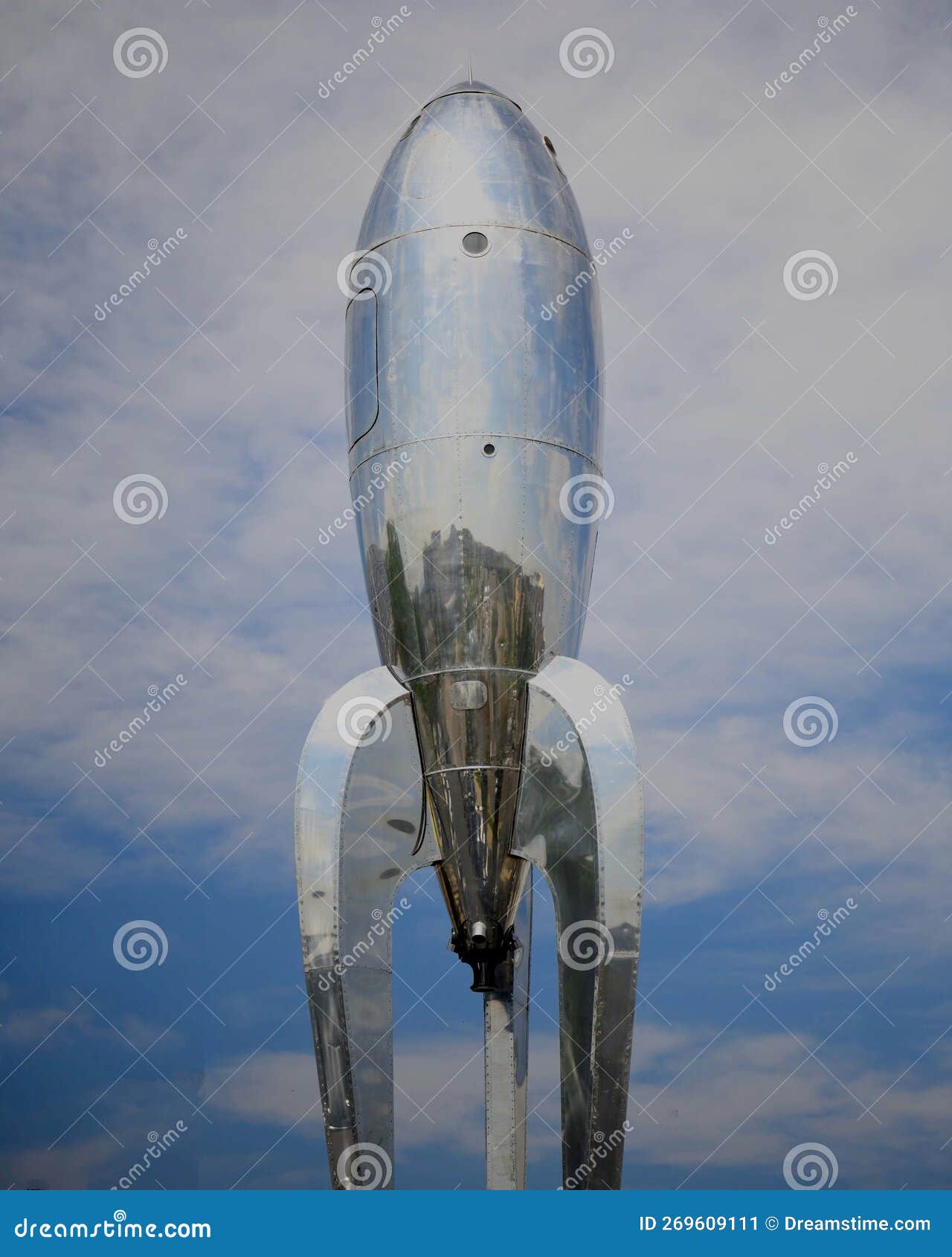 Vertical Closeup of a Silver Space Rocket in the Sky Near Another ...
