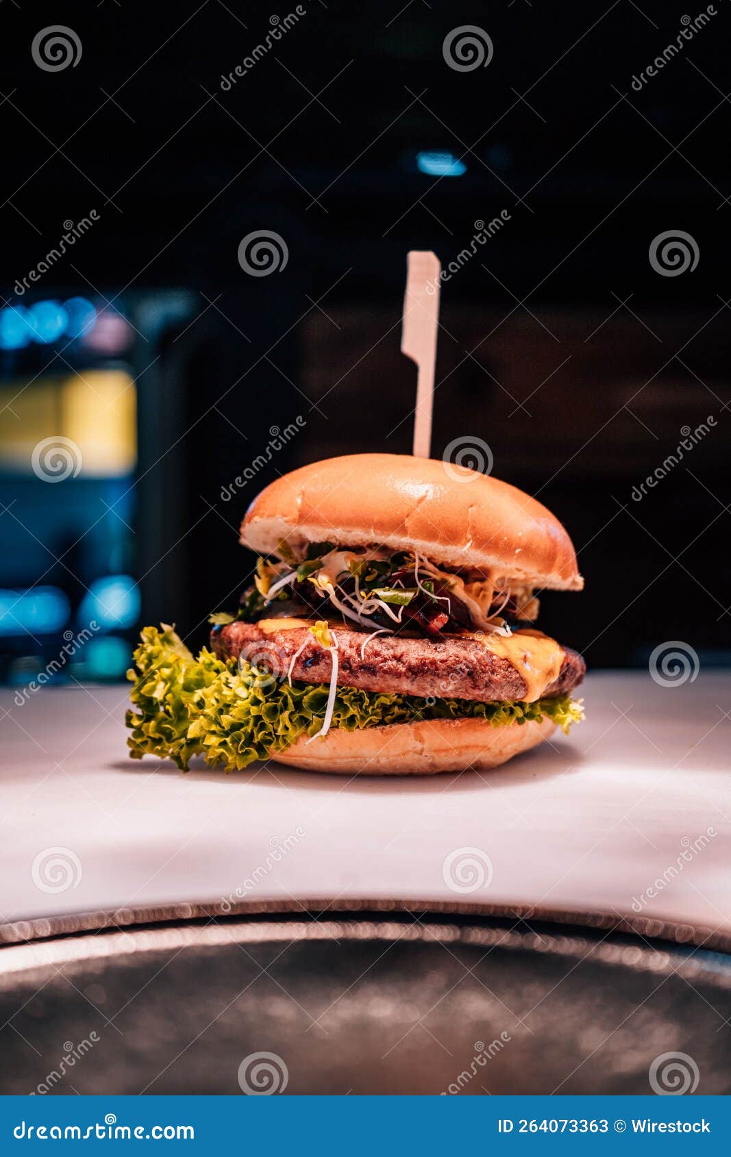 Vertical Closeup of a Tasty Burger on the Table. Stock Image - Image of ...