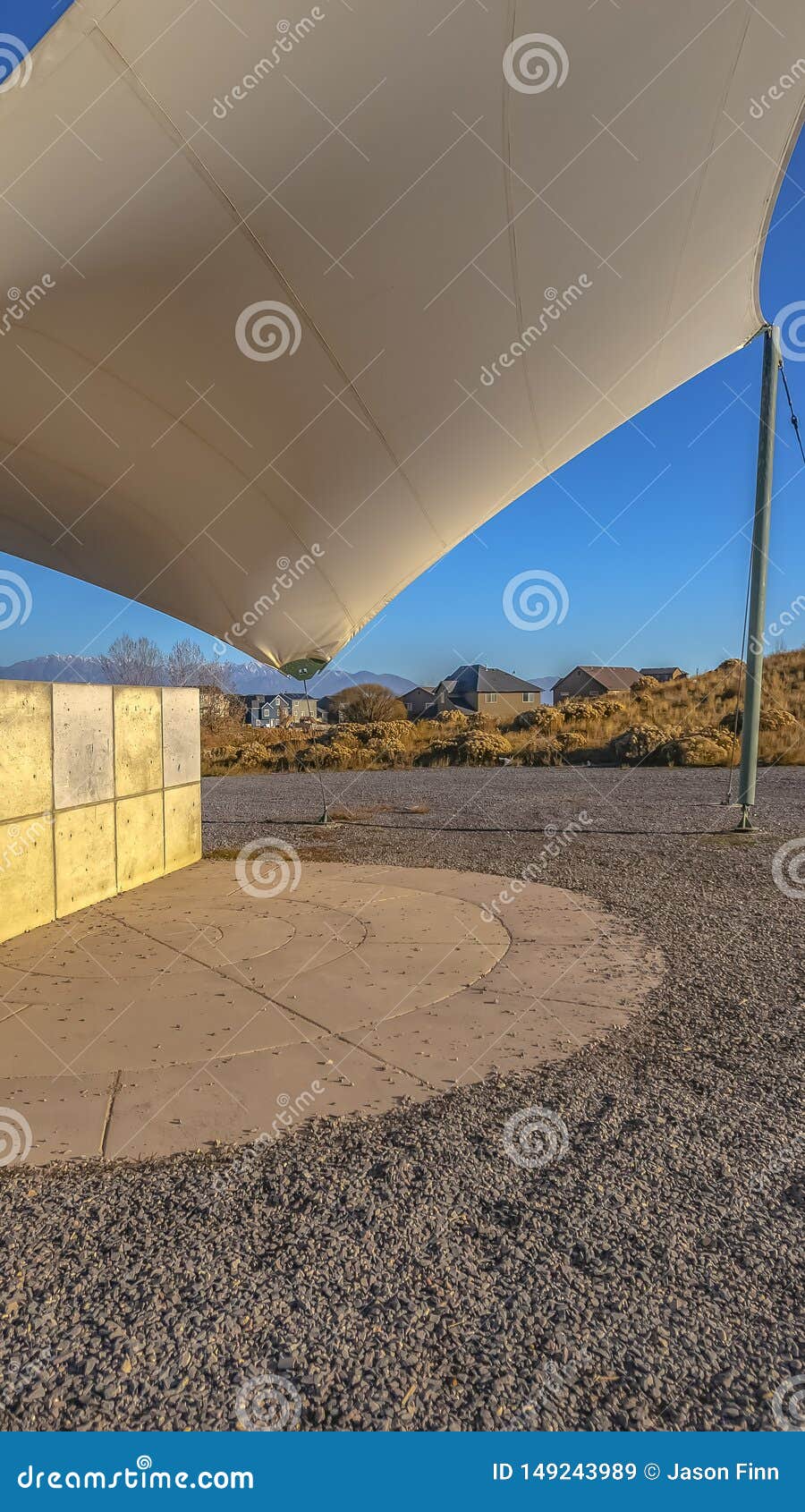 Vertical Concrete Rectangular Structure on a Rocky Ground Under a White ...