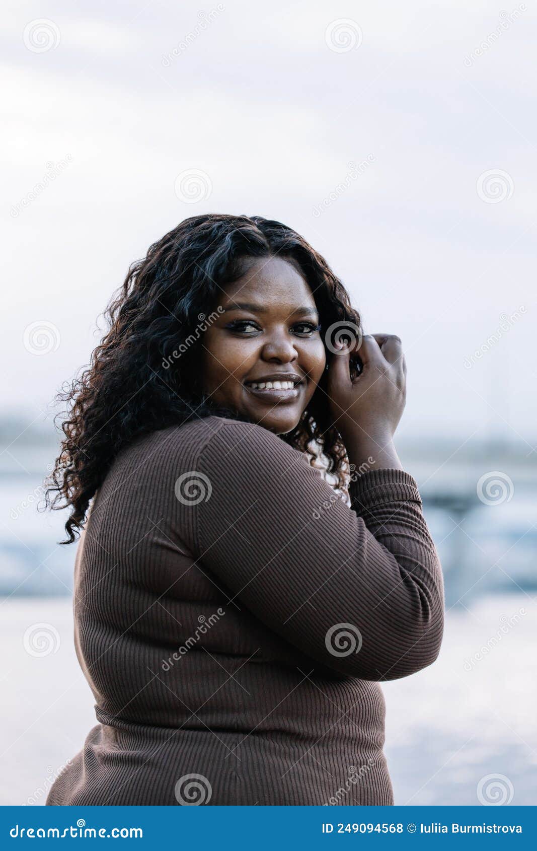 Vertical Confident Black Haired Afro American Plump Woman Look Camera
