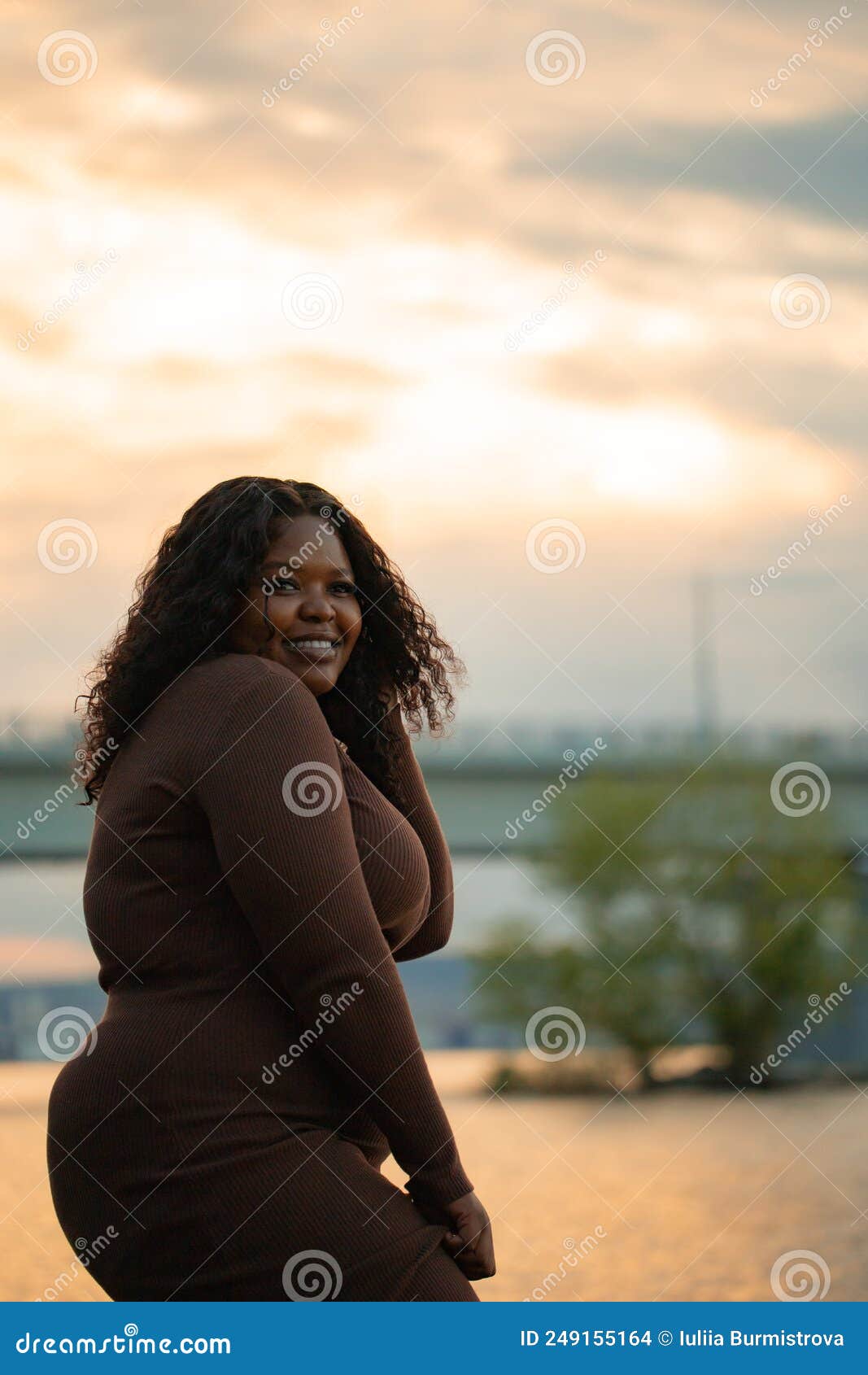 Vertical Curly Black Haired Cute Smiling And Pleasant Plump Afro