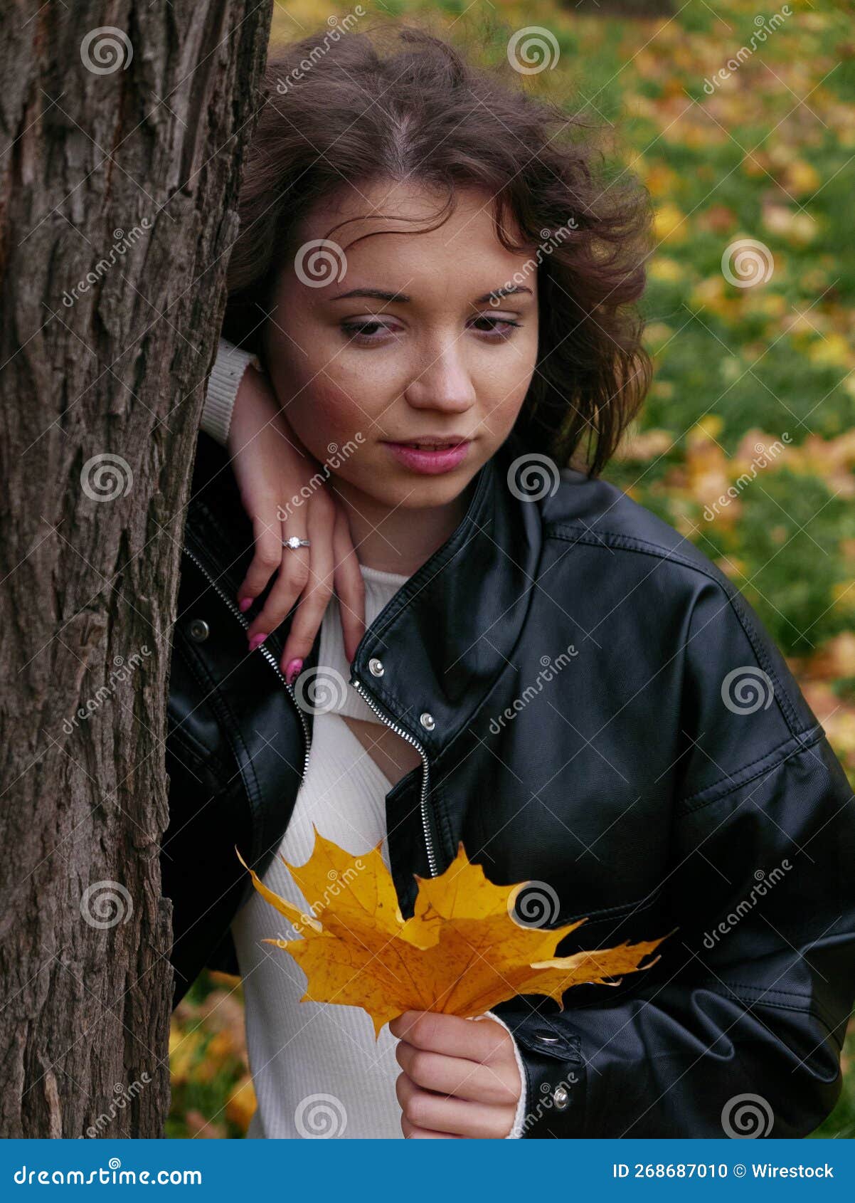 Vertical of a Curly Brunette Caucasian Female Posing with a Yellow ...