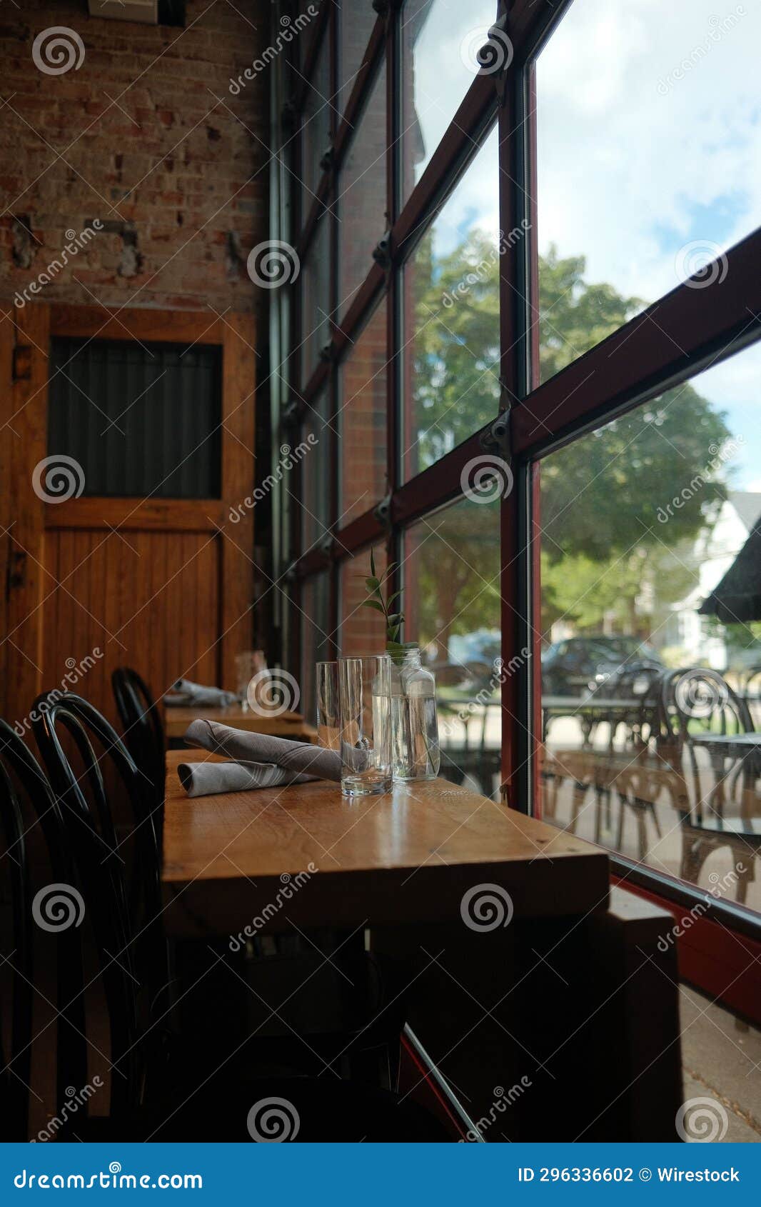 Vertical of a Decorated Table at a Cafe Near a Window Stock Photo ...