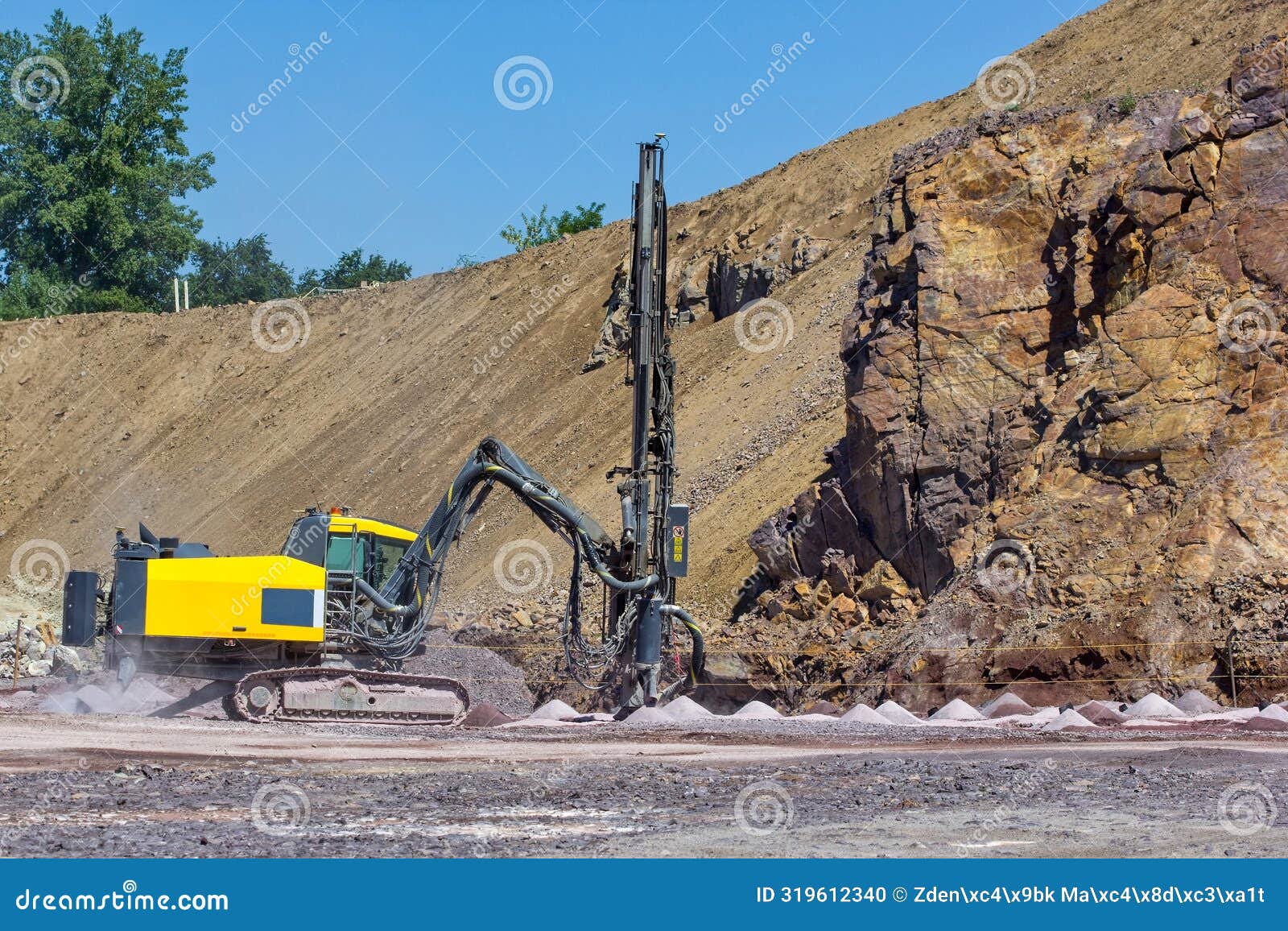 The Vertical Drilling Rig Machine in Stone Quarry. Stock Photo - Image ...