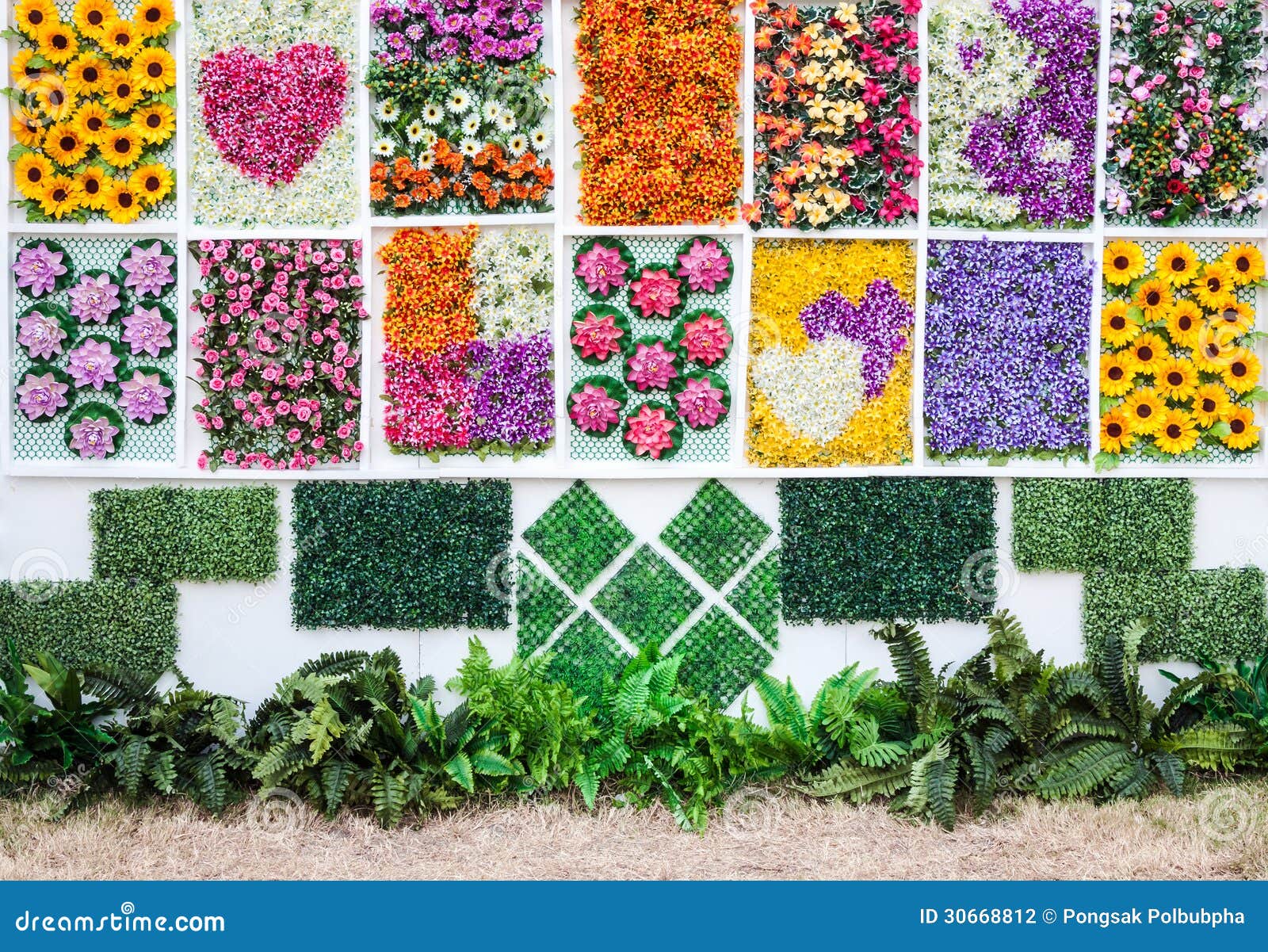 Vertical Flower Bed. Plants Are Located In A Flower Bed Pipe. Stock ...