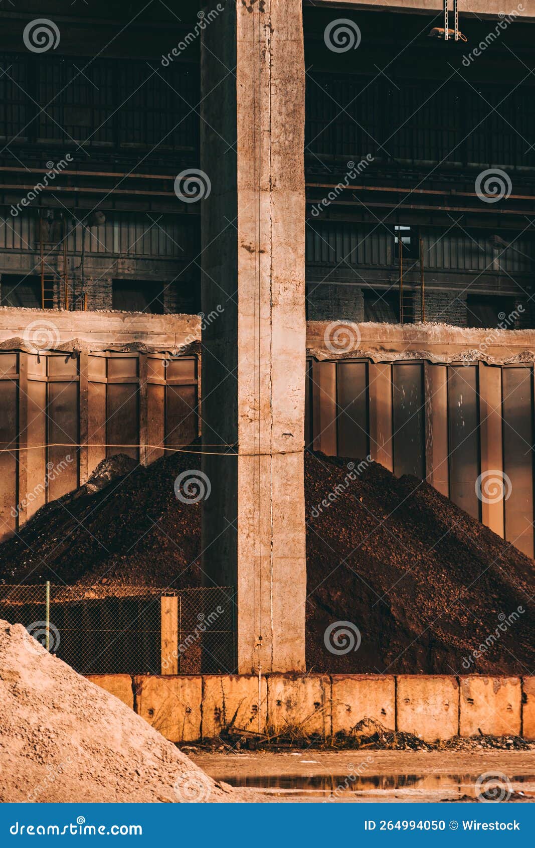 Vertical Footage of a Construction with a Pillar in the Front and a ...