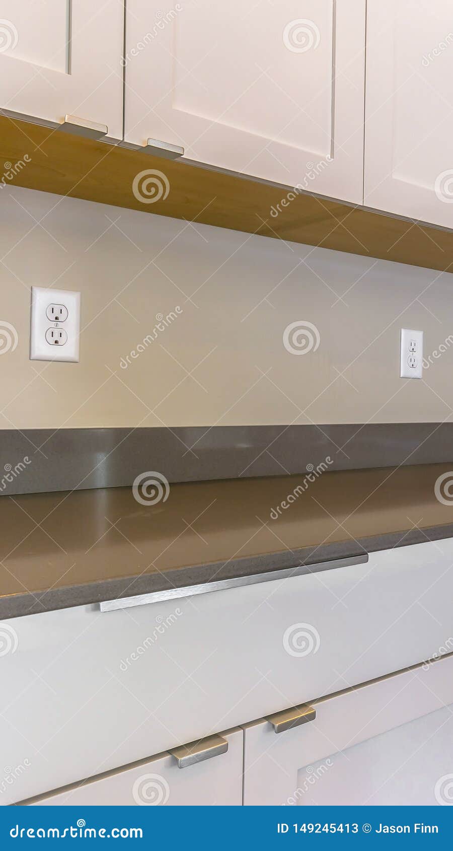 Vertical Frame Kitchen Interior of a House with White Cabinets Below ...