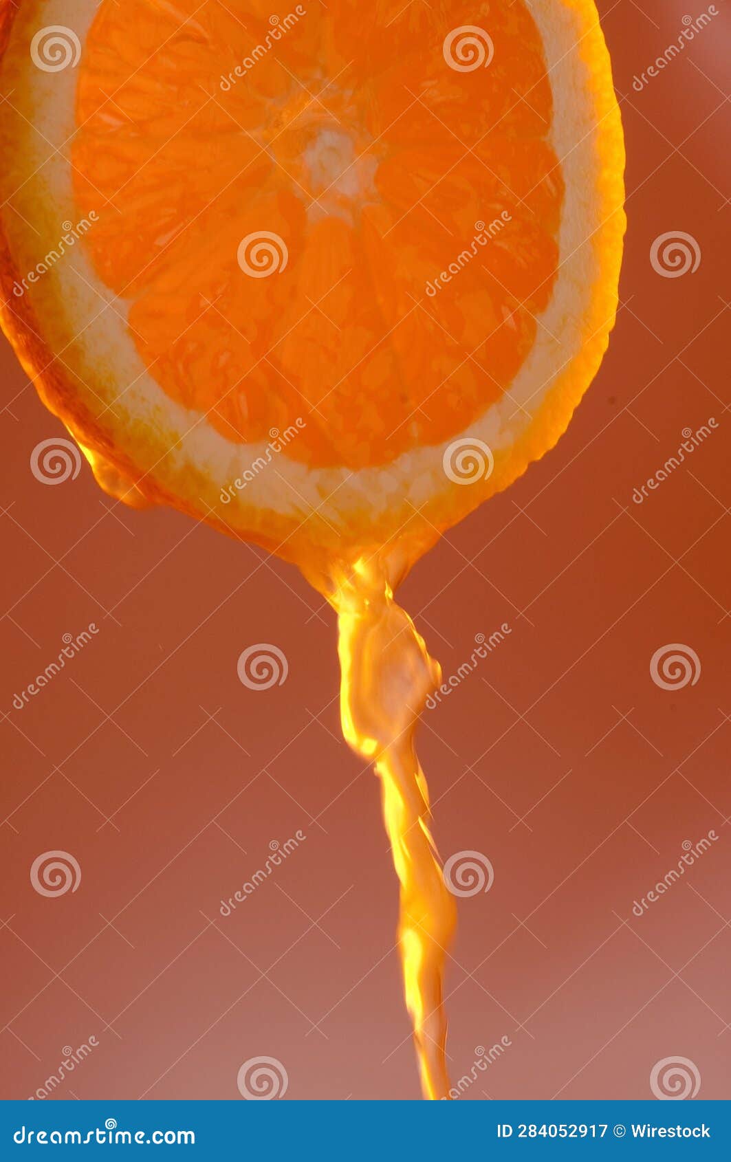 Vertical of Fresh Orange Cut on an Orange Background Stock Image ...