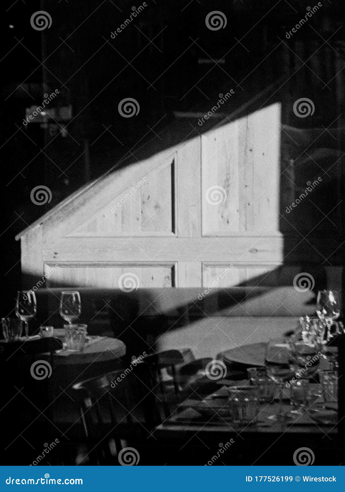 Vertical Grayscale Shot of Dining Tables Inside the Restaurant Stock ...