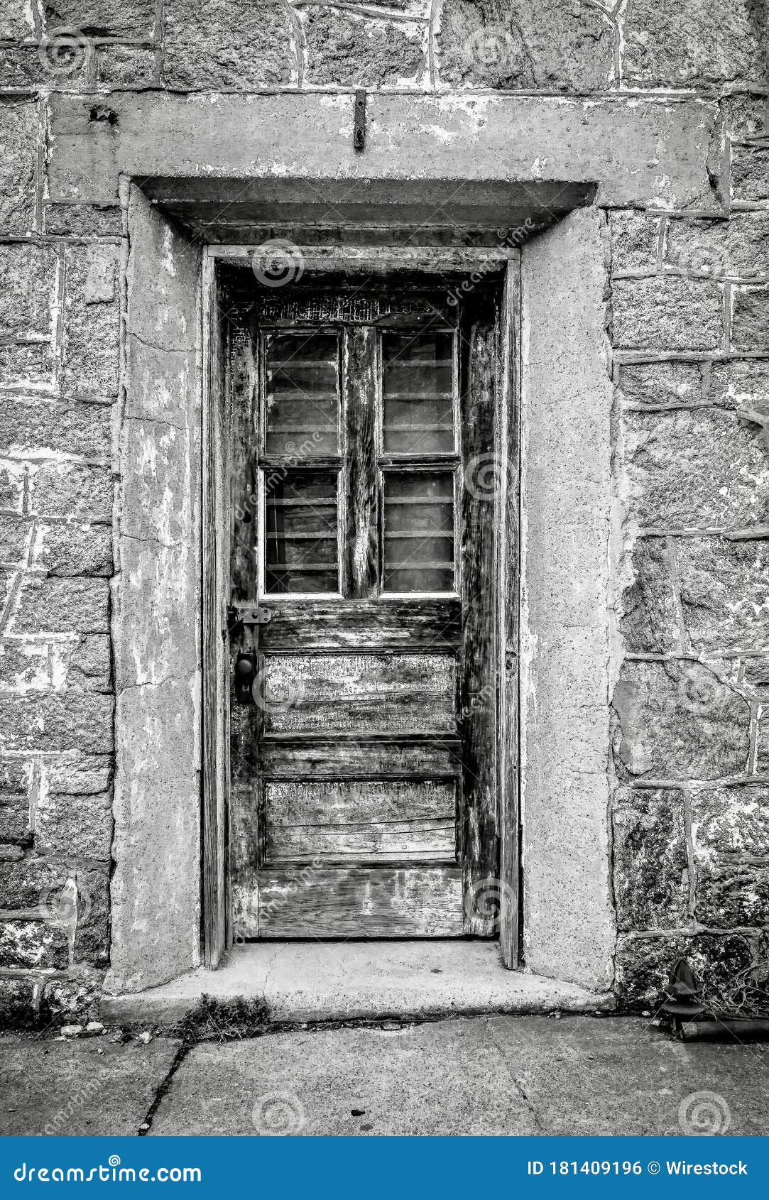 Vertical Grayscale Shot of a Door at the Eastern State Penitentiary in ... Vertical Grayscale Shot of a Door at the Eastern State Penitentiary in ...