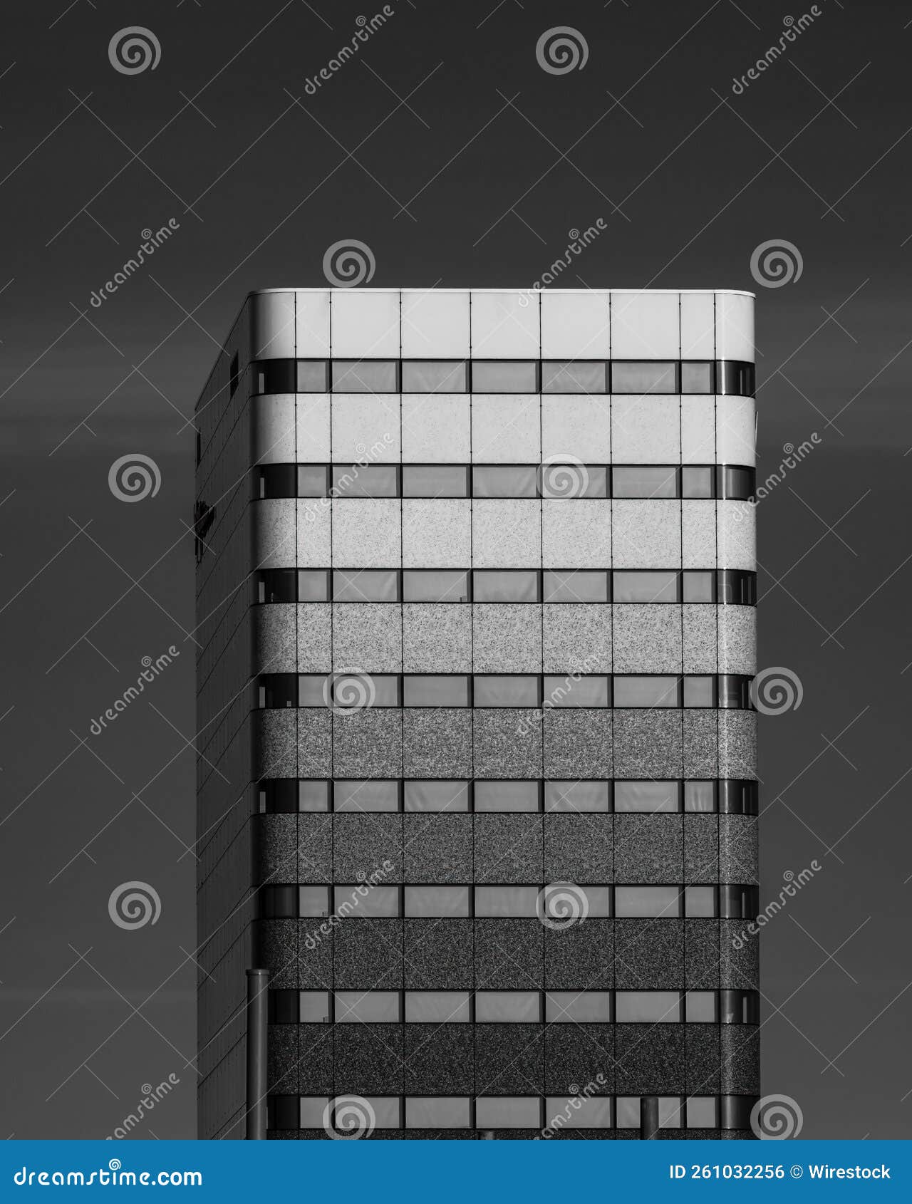 Vertical Grayscale Shot of a Modern Building Stock Photo - Image of ...