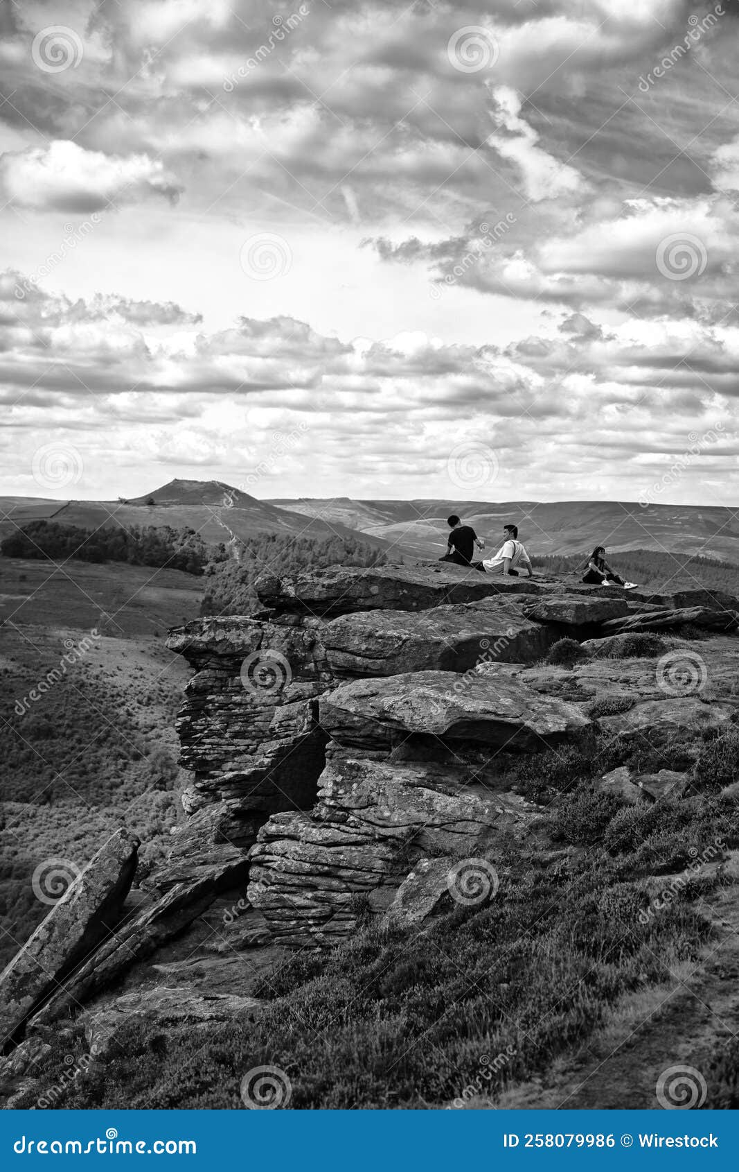 Vertical Grayscale Shot of People Looking at the View from Bamford Edge ... Vertical Grayscale Shot of People Looking at the View from Bamford Edge ...