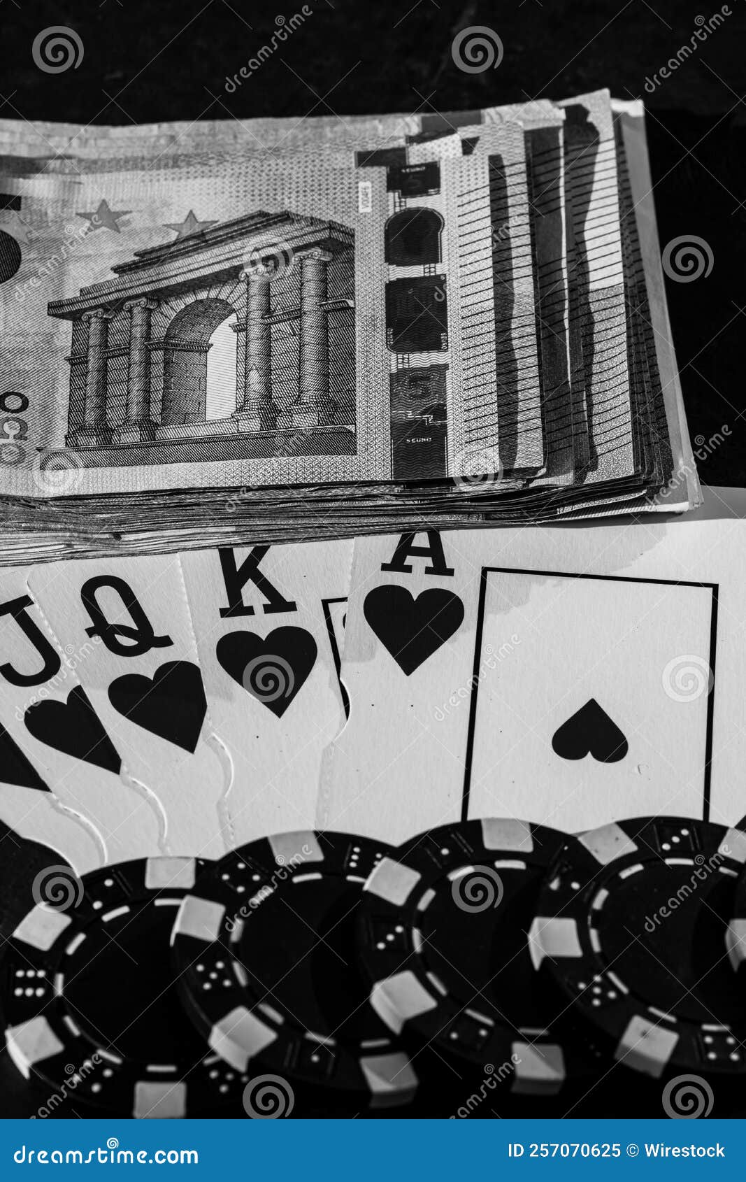 Vertical Grayscale Shot of Poker Chips, a Stack of Paper Bills and ...