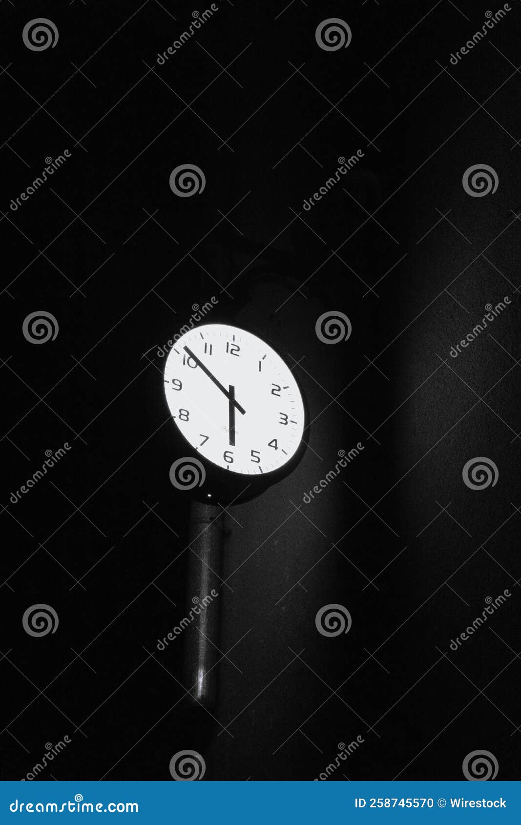 Vertical Grayscale Shot of a Round Decorative Small Clock Stock Photo ...