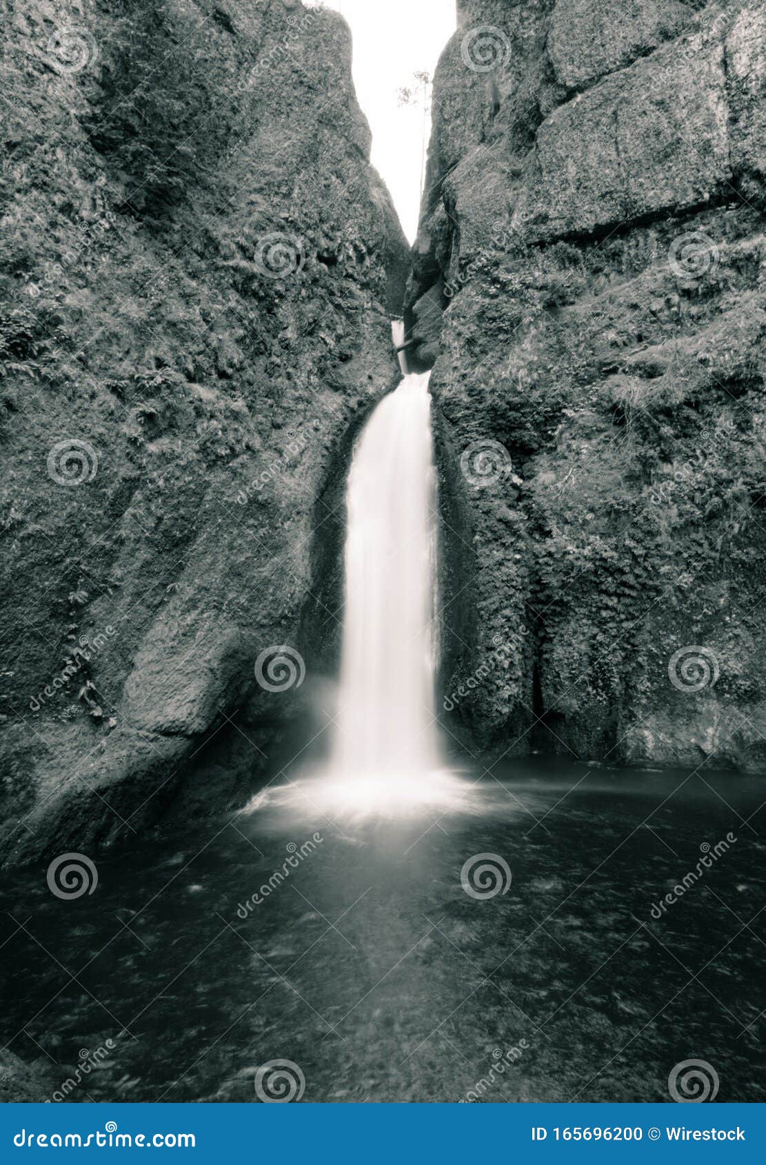 Vertical Grayscale Shot of a Strong Waterfall Flowing in the River ...