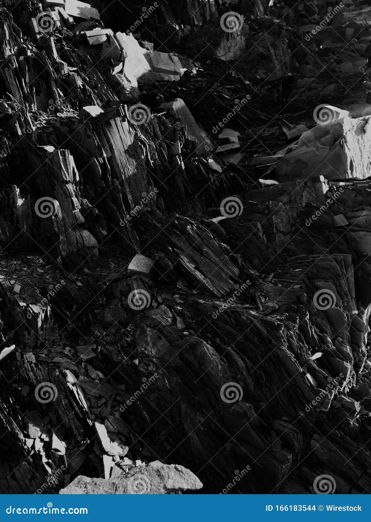 Vertical Grey Scale Shot of Beautiful Layers of Old Rocks on the ...