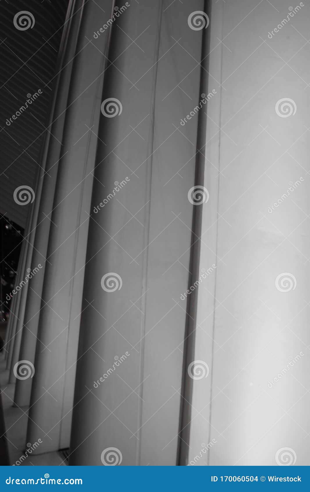 Vertical Greyscale Shot of a Modern Architectural Structure with ...