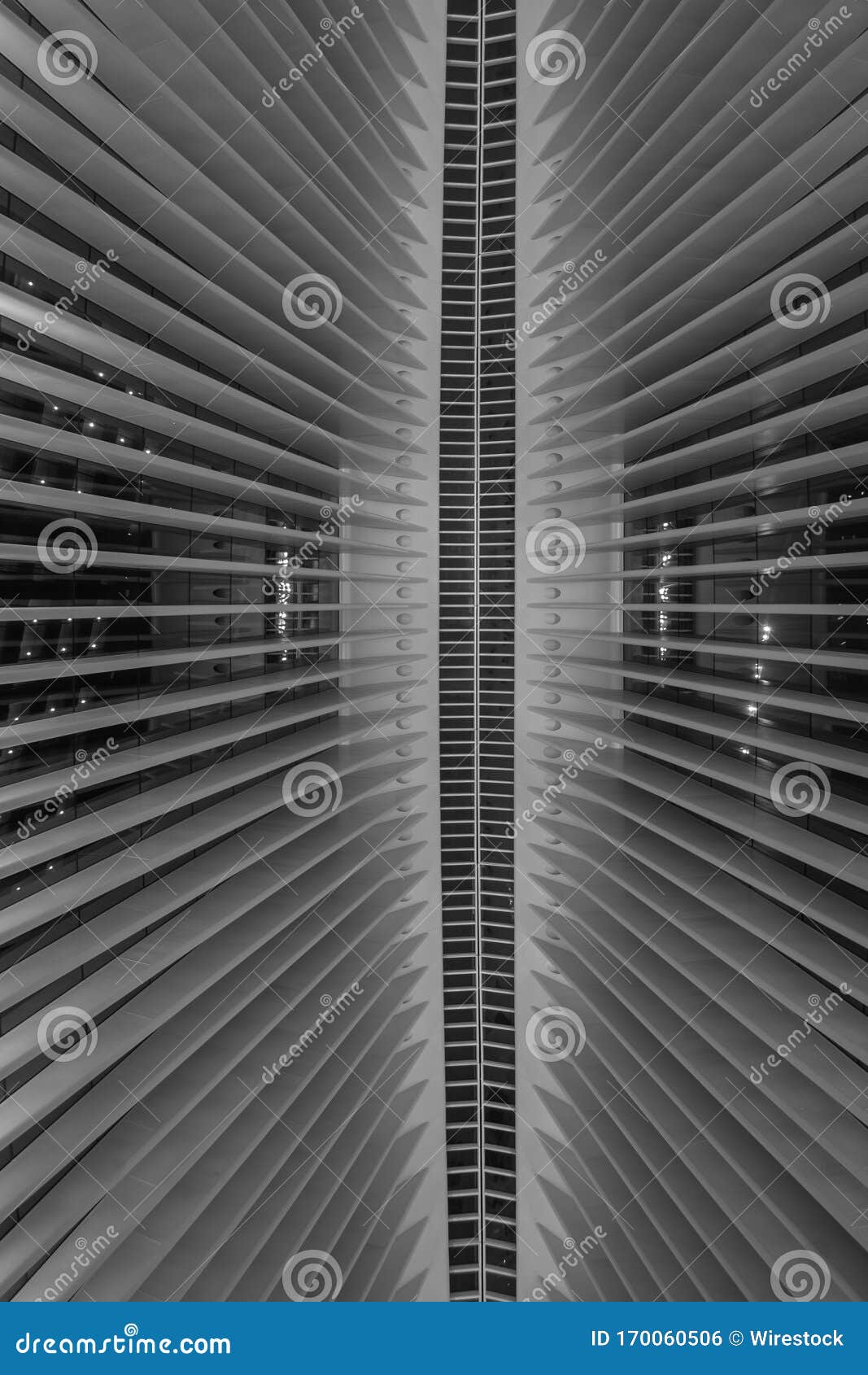Vertical Greyscale Shot of a Modern Architectural Structure in a Glass ...