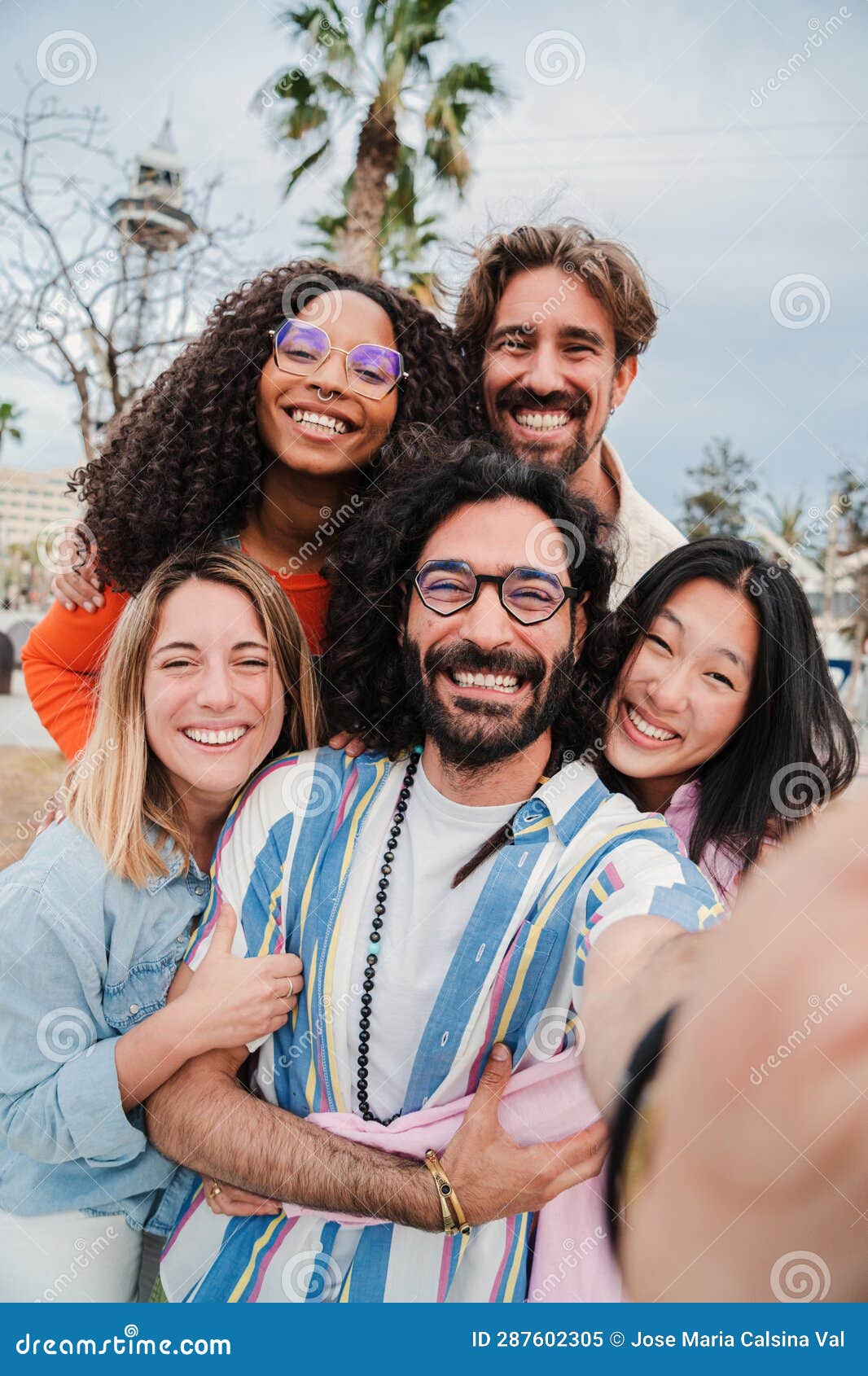 Vertical Group Of Multiracial Young Adult People Smiling Taking A