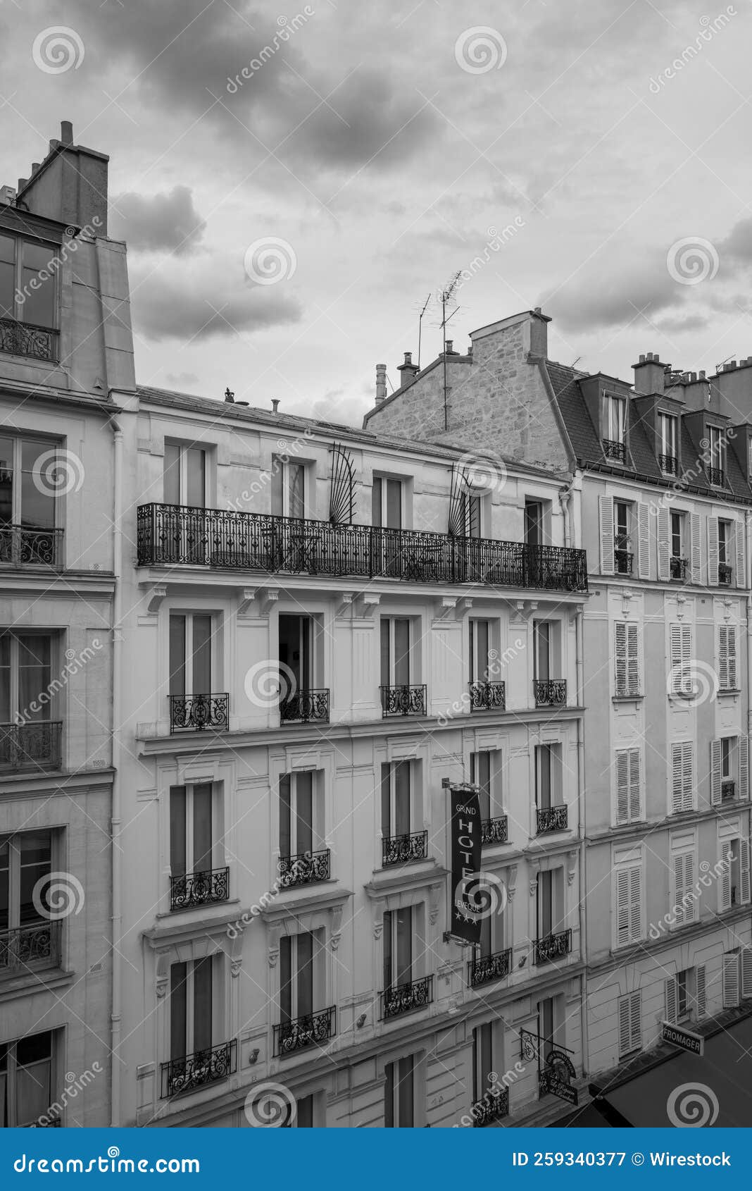 Vertical High-angle Grayscale of an Old Paris Building, Cloudy Sky ...