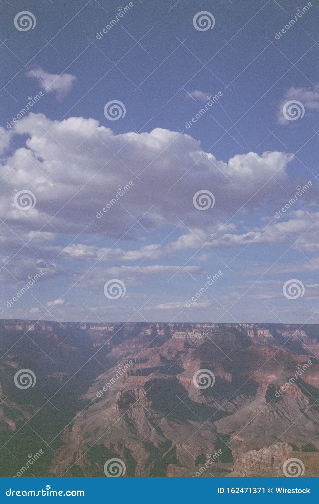 Vertical High Angle Shot of Canyons Enveloped in Fog Under the ...