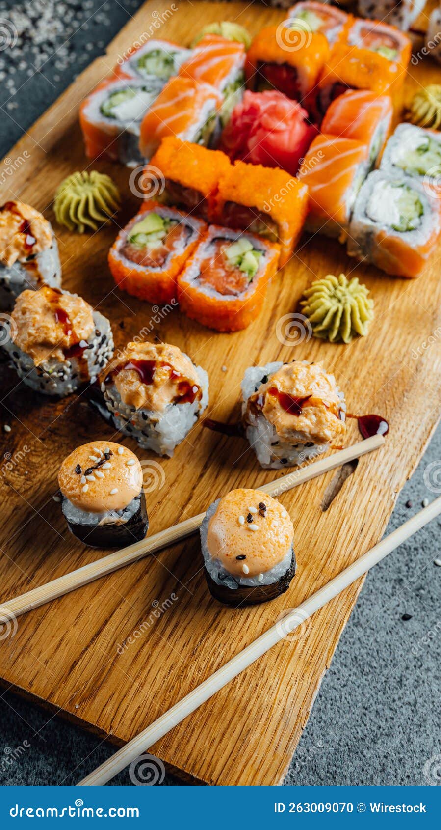 Vertical High-angle Shot of Different Types of Sushi Rolls with ...