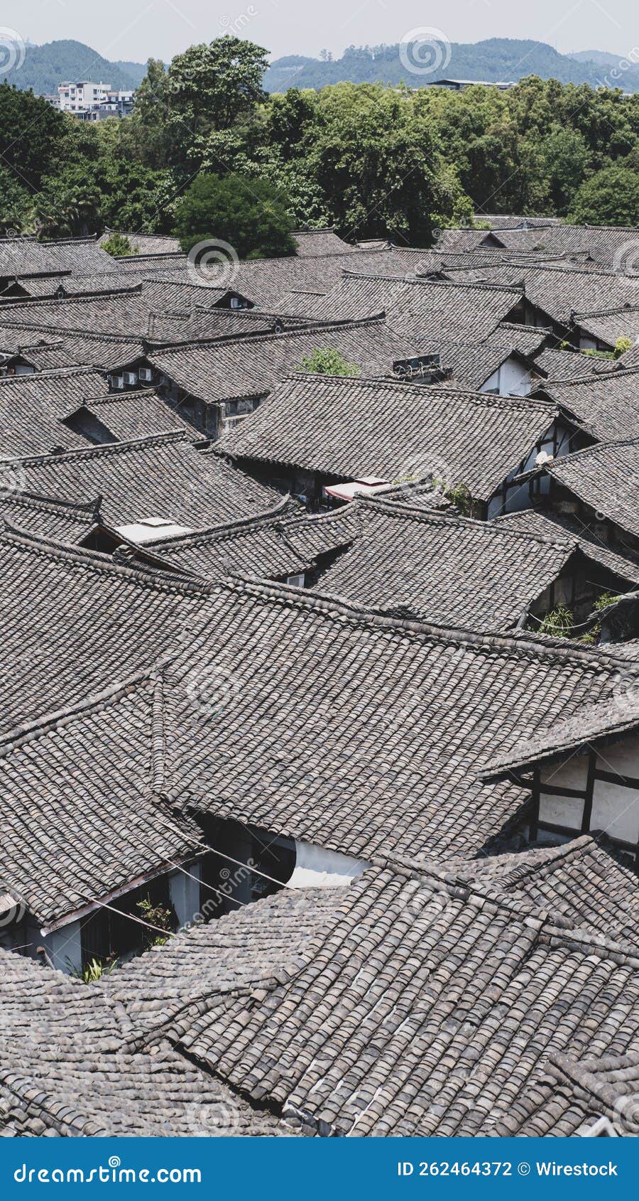 Vertical High Angle Shot of the Identical Roofs of Small Houses in a ...