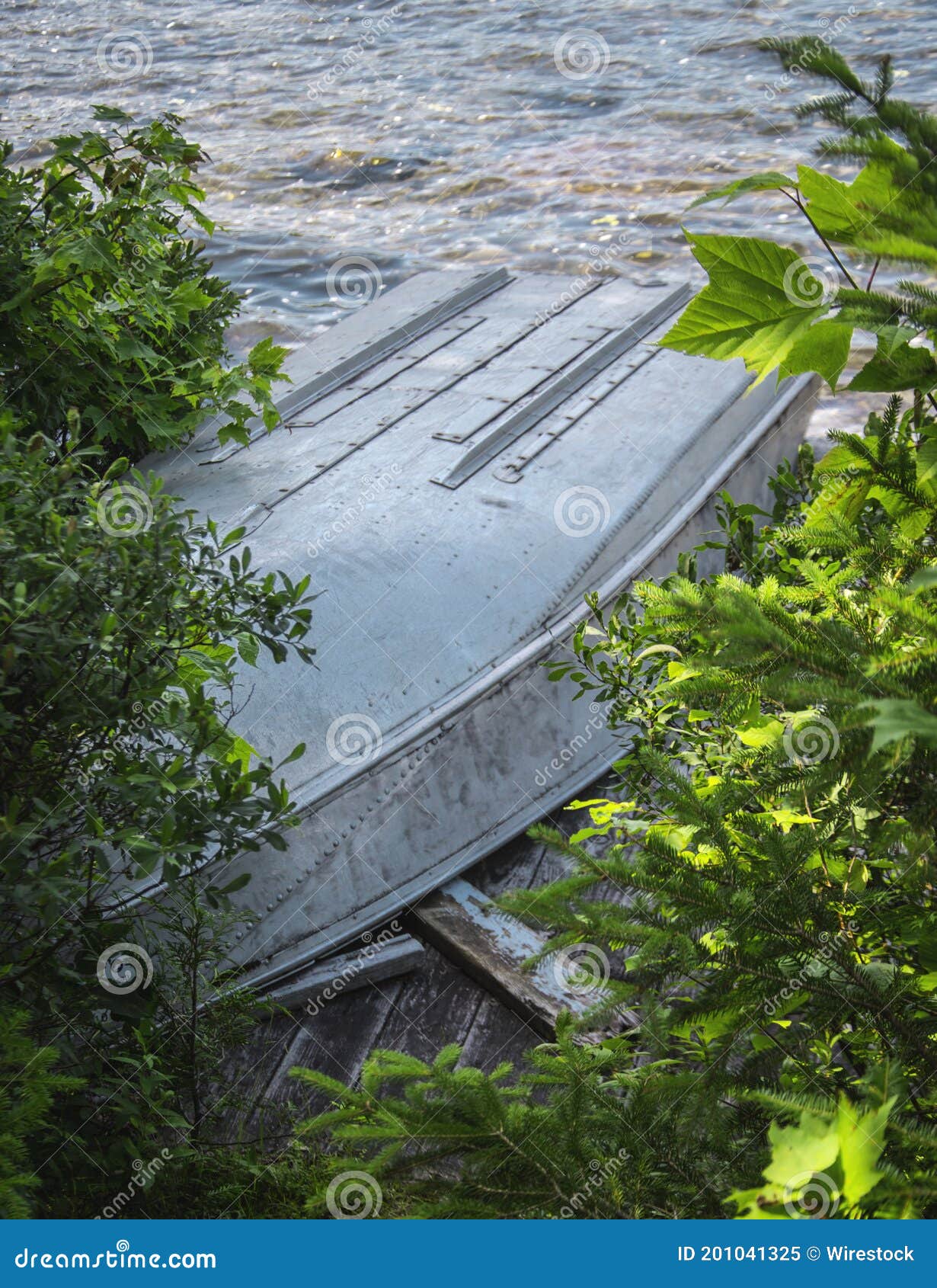 Vertical High Angle Shot of an Upside-down Rowboat on a Dock Stock ...